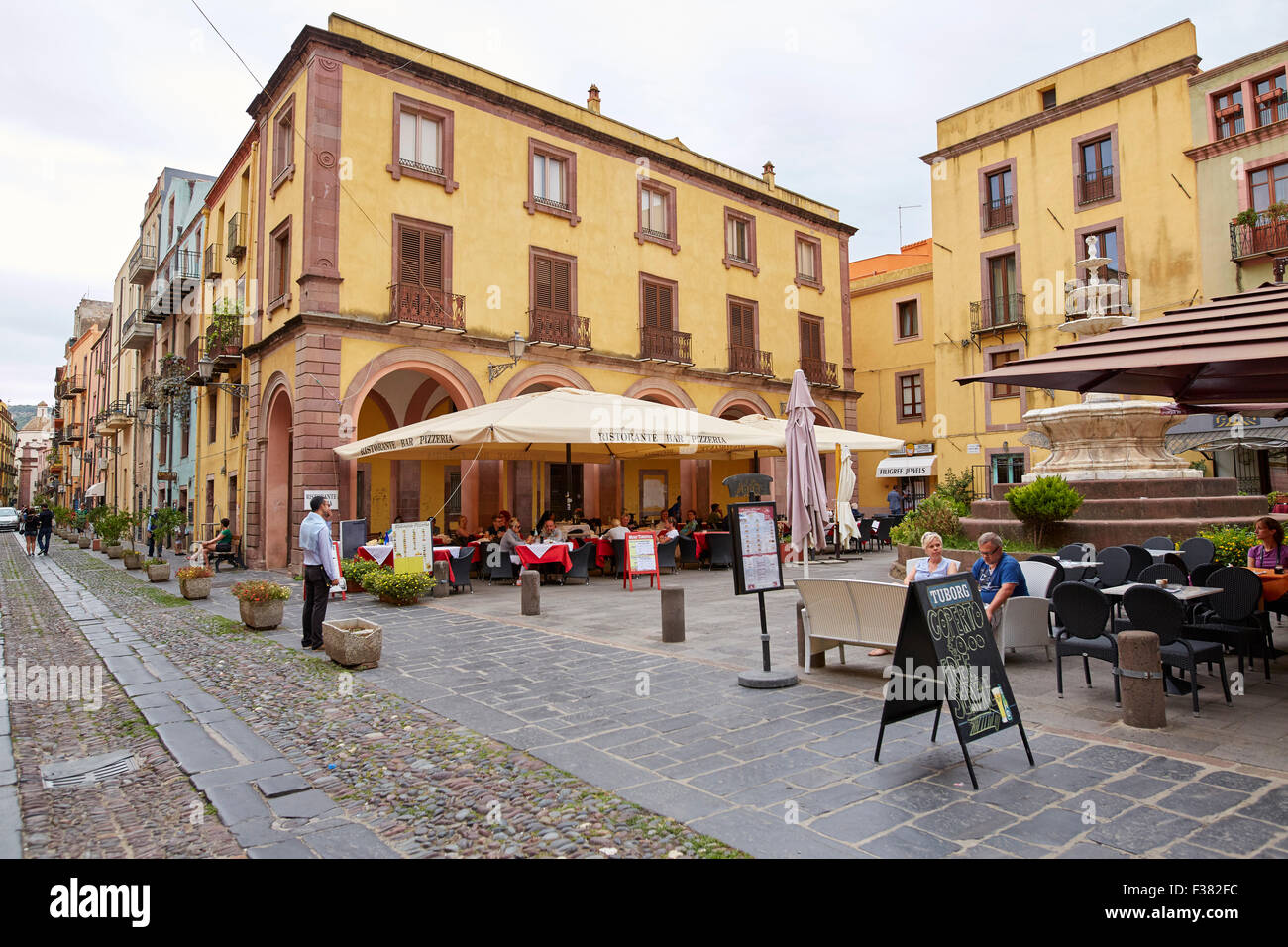 Cafe scenes, Bosa, Sardinia Stock Photo - Alamy