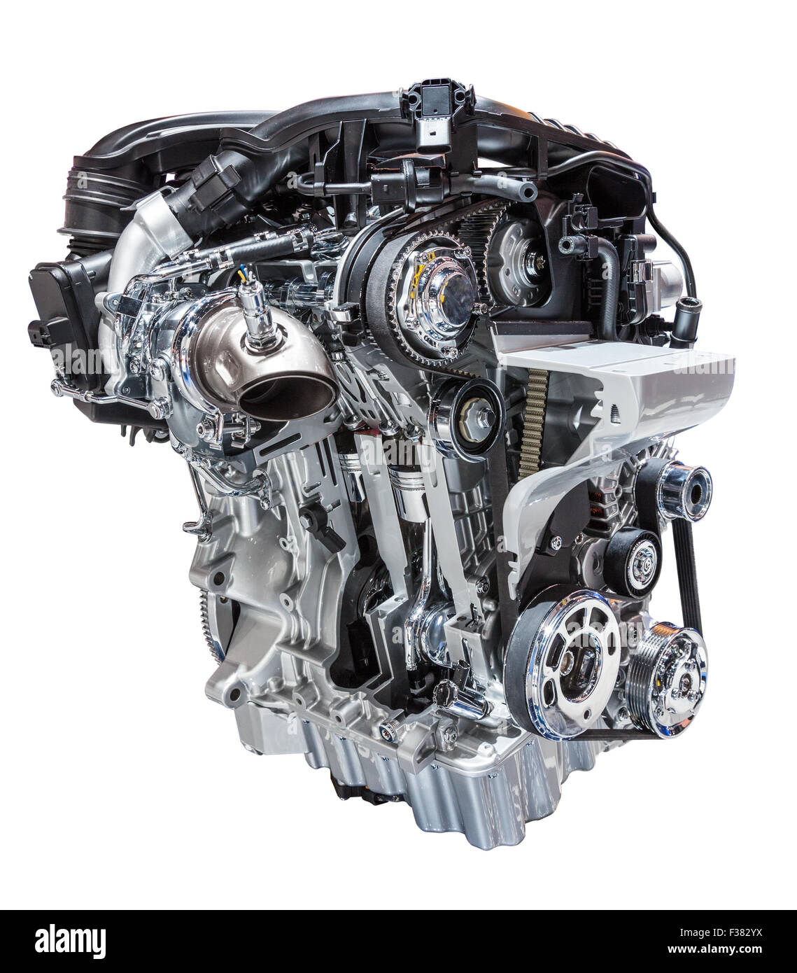 Modern downsized three cylinder cylinder car engine isolated on white ...