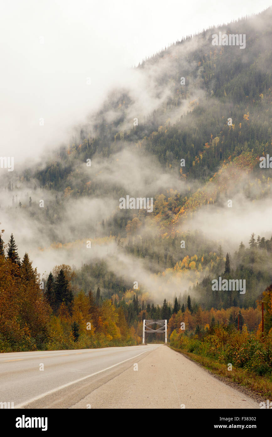 Clearing storm by a bridge and mountain Stock Photo - Alamy