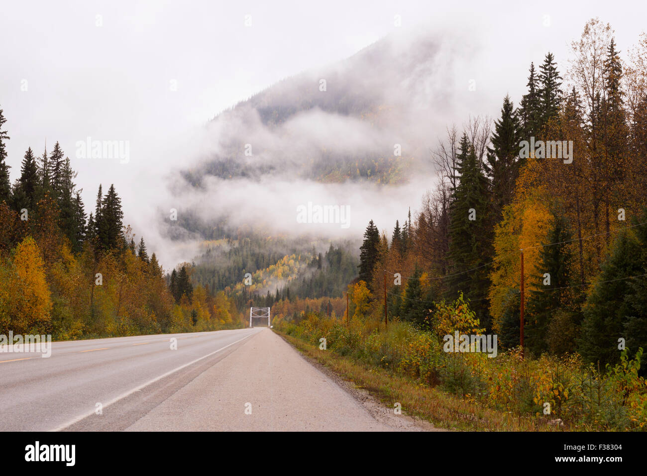 Clearing storm by a bridge and mountain Stock Photo - Alamy