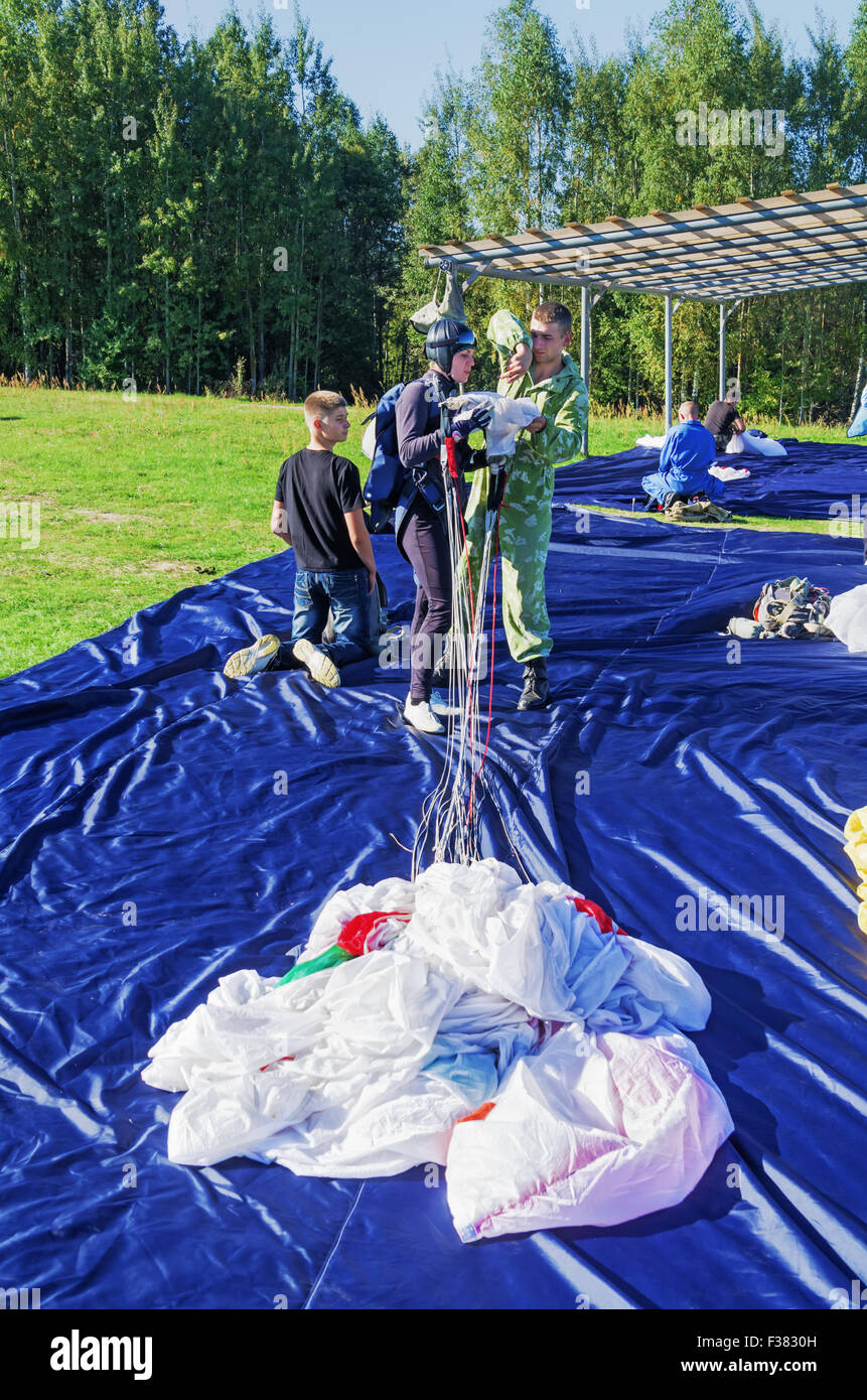 Parachutists - 2014. After landing. Packing of parachutes Stock Photo ...