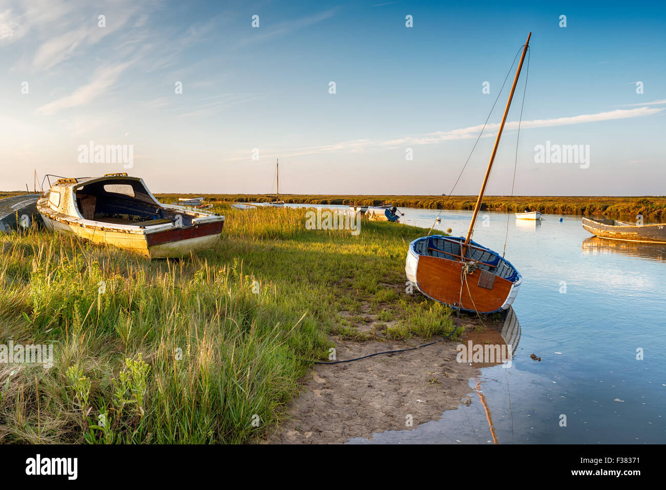 Fishing boats on the salt marshes at Blakeney on the Norfolk coast ...