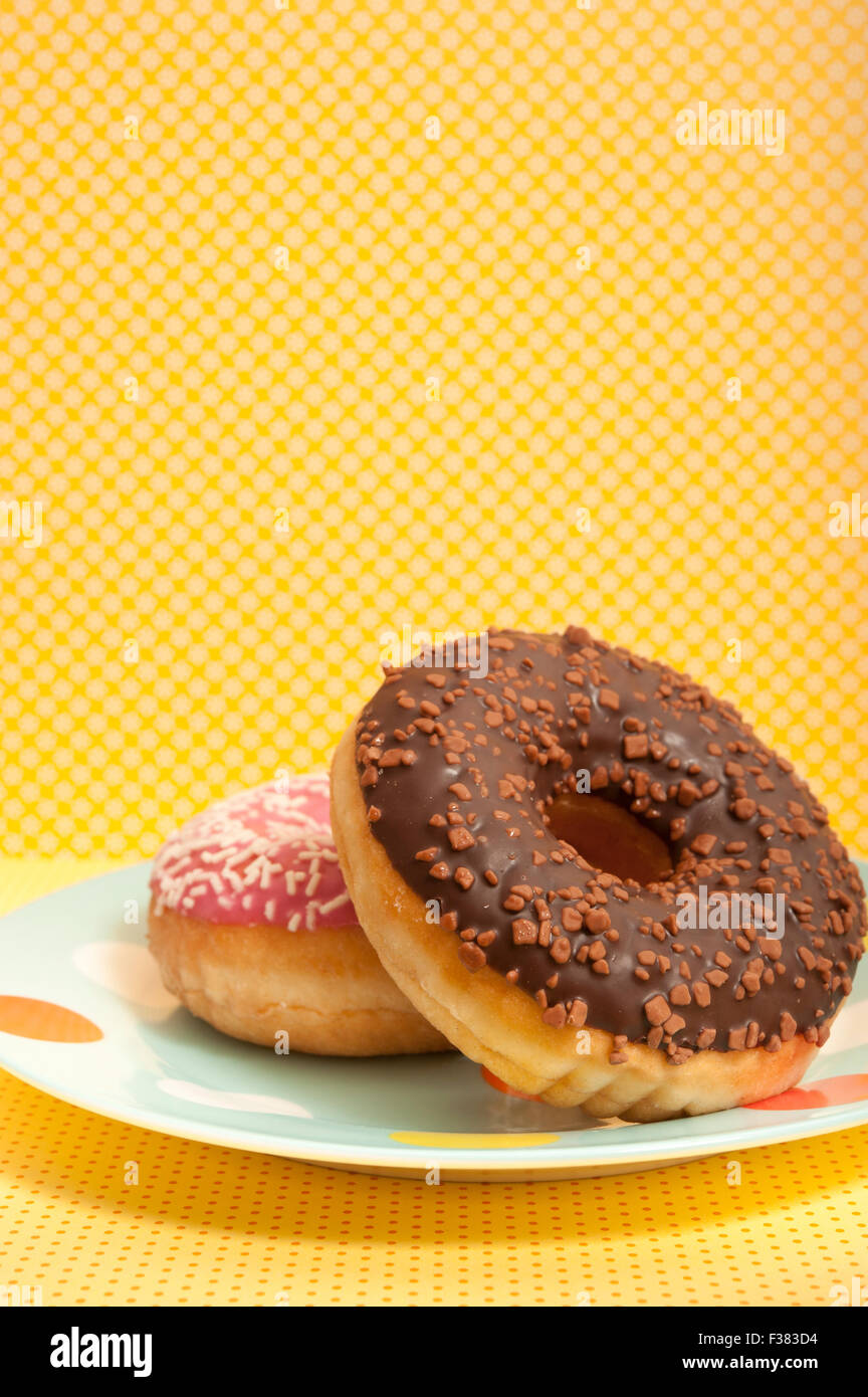 glazed doughnuts on a plate Stock Photo - Alamy