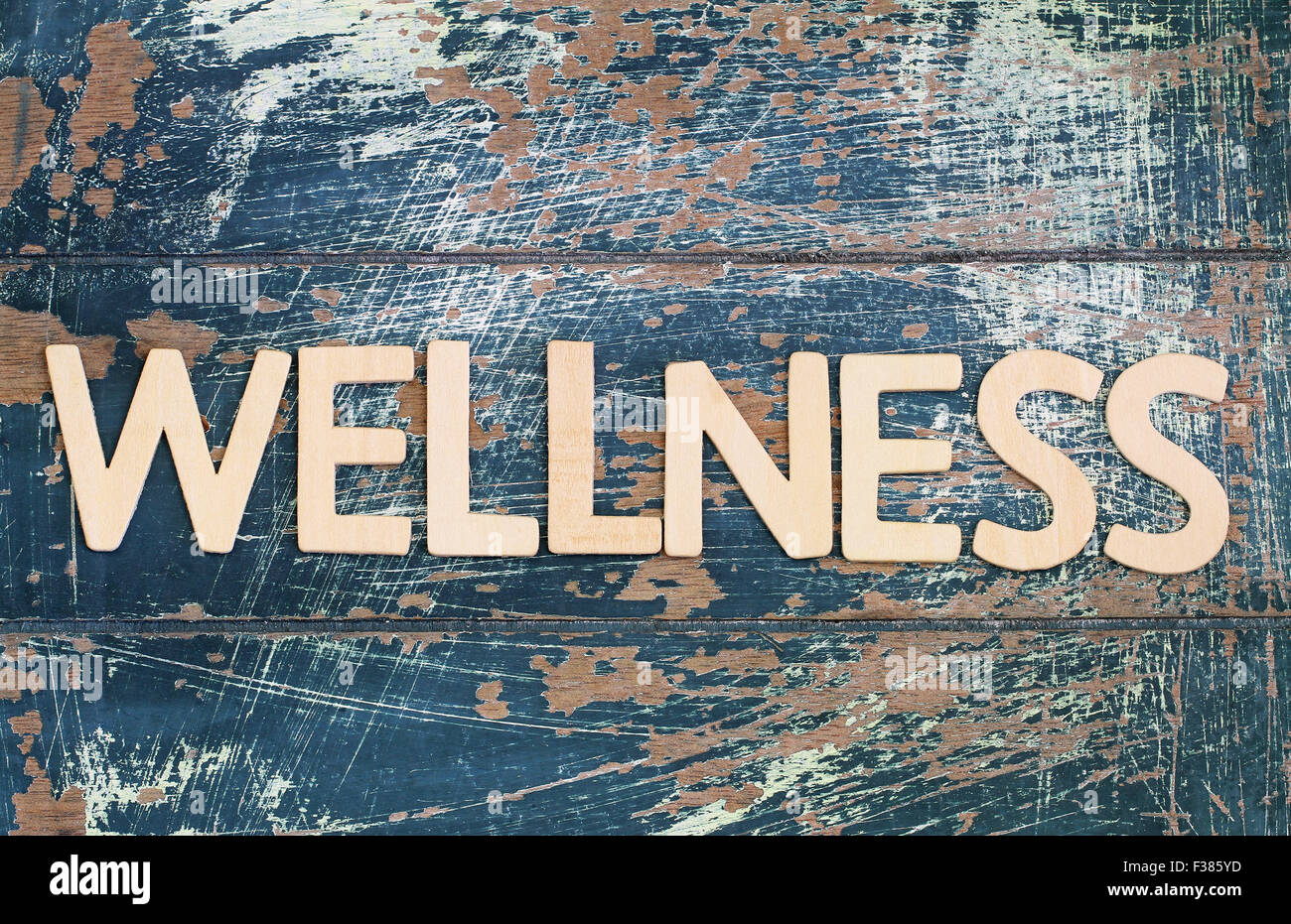 Wellness written with wooden letters on rustic surface Stock Photo - Alamy