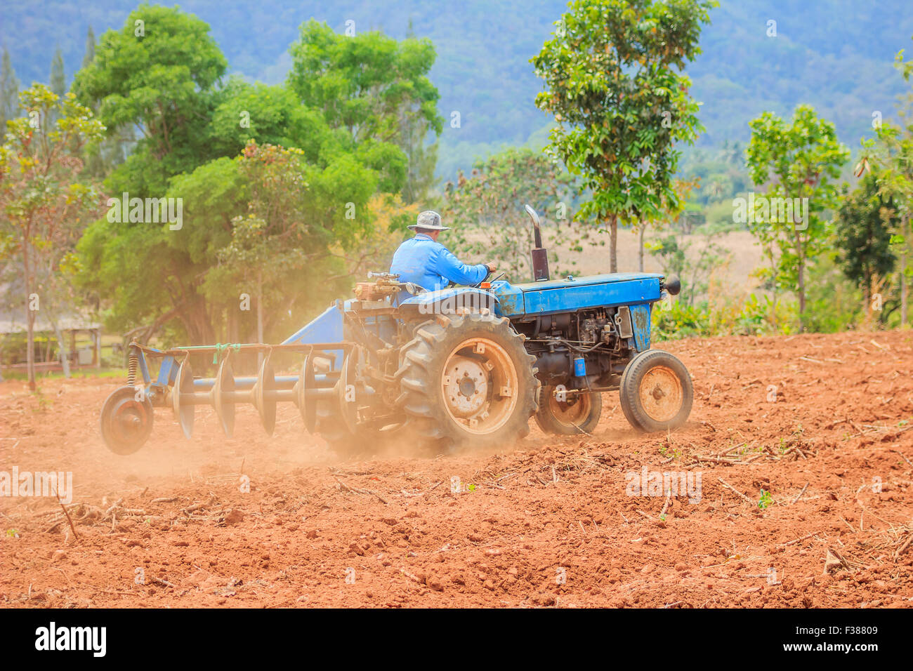 Harvesting work with tractor hi-res stock photography and images - Alamy