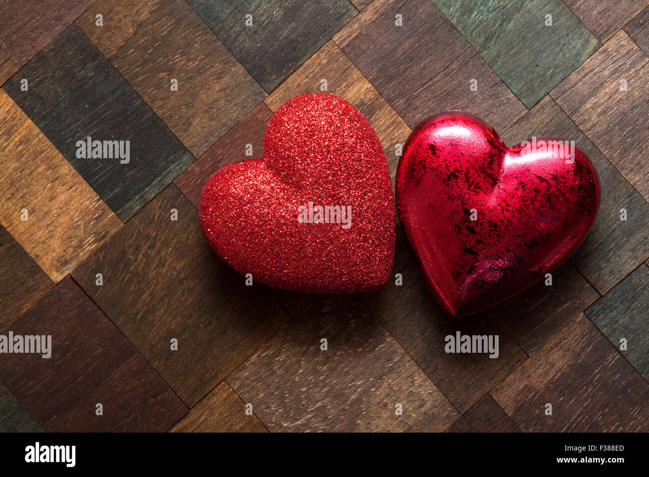 Red hearts on a dark wooden table Stock Photo - Alamy