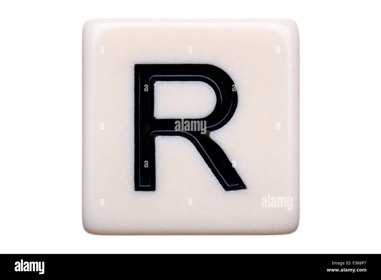 A macro shot of a game tile with the letter R on it on a white ...