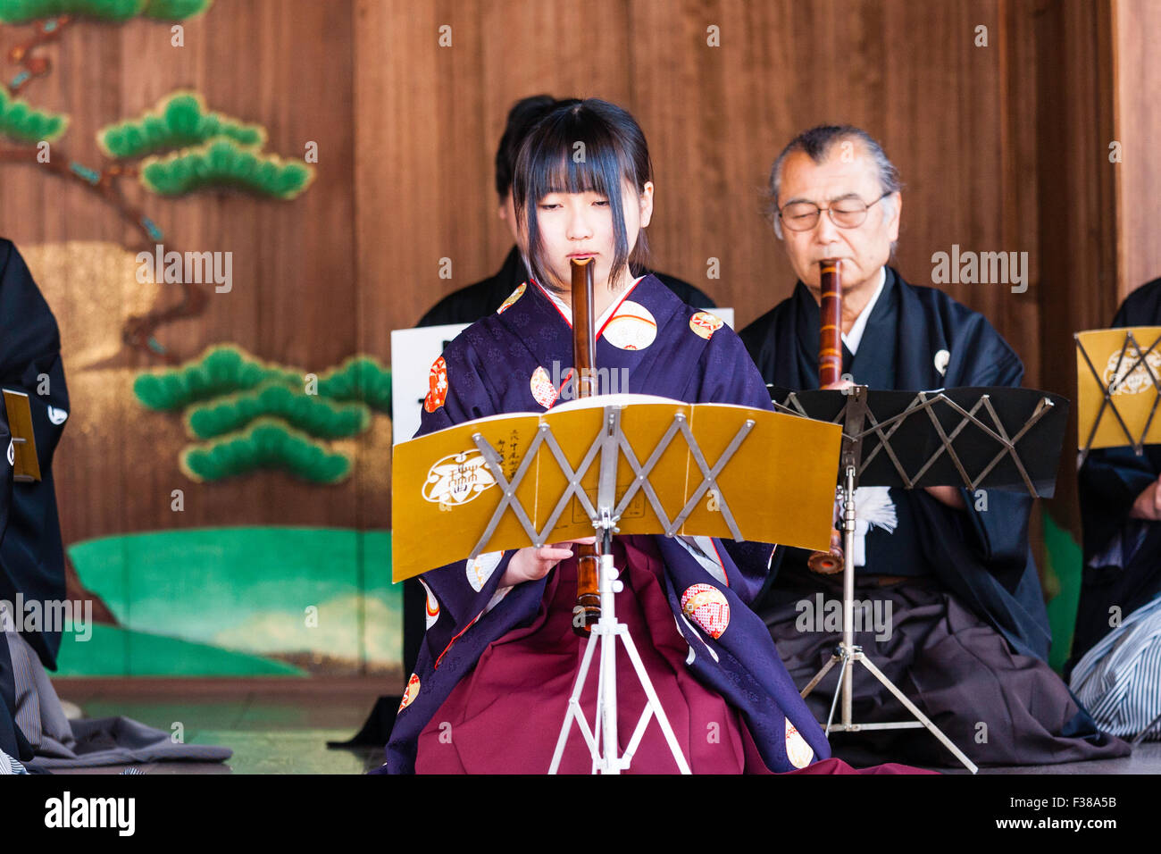 Young woman playing flute hi-res stock photography and images - Alamy