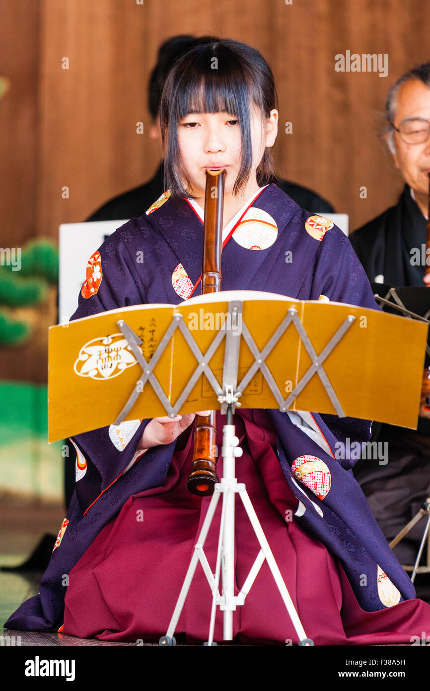 Young woman playing flute hi-res stock photography and images - Alamy