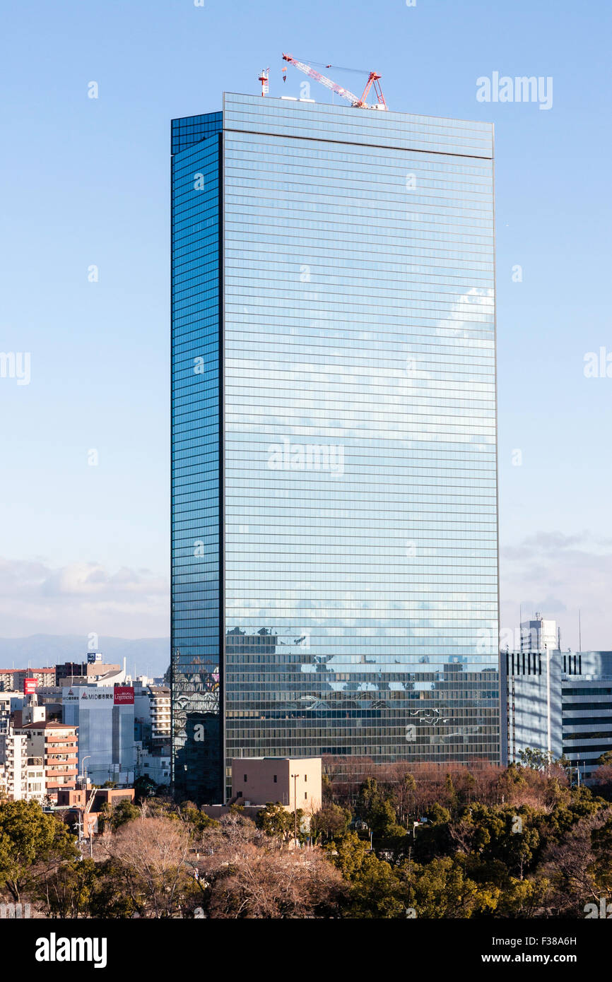 Osaka City, Japan. Tall single office tower block entirely covered in ...