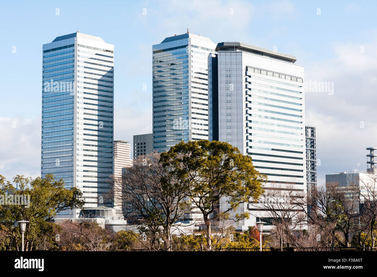 The Panasonic twin Towers near Osaka castle lit up by early morning ...