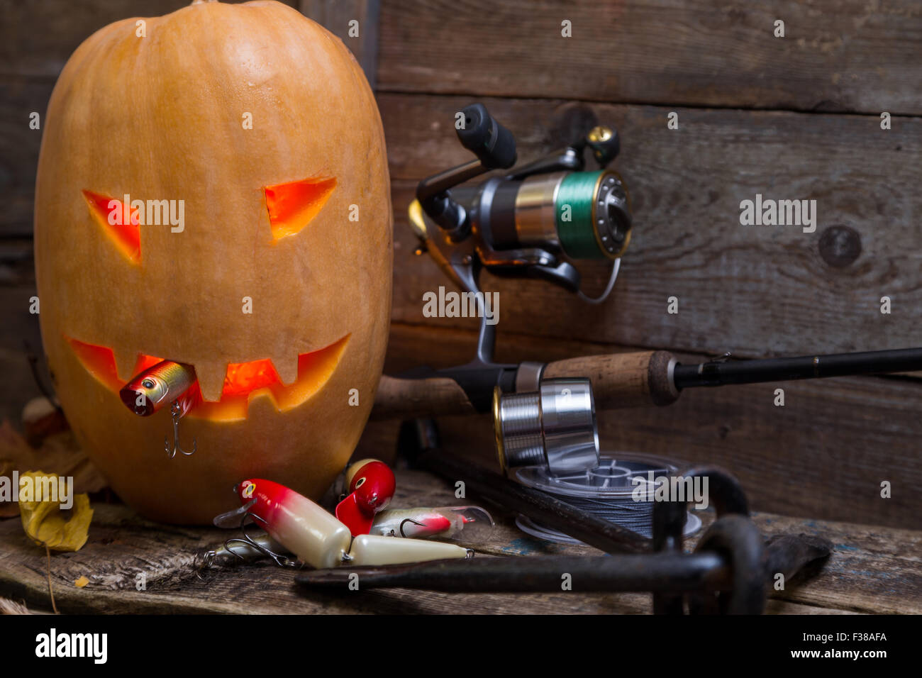 halloween pumpkin head in heat and eyeglass with fishing tackles on ...