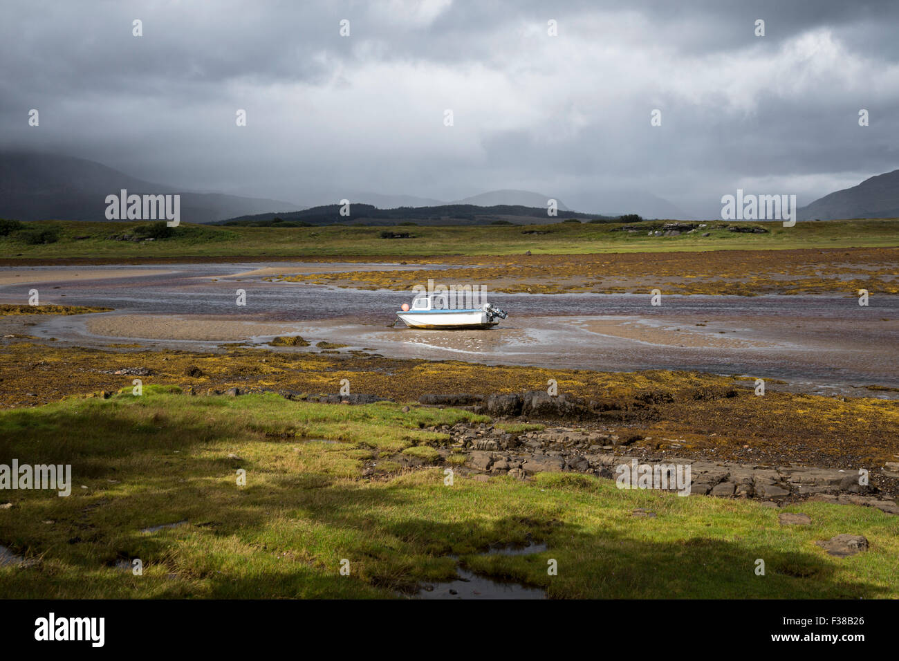 Small boat in a narrow tidal inlet on the Isle of Skye Stock Photo - Alamy