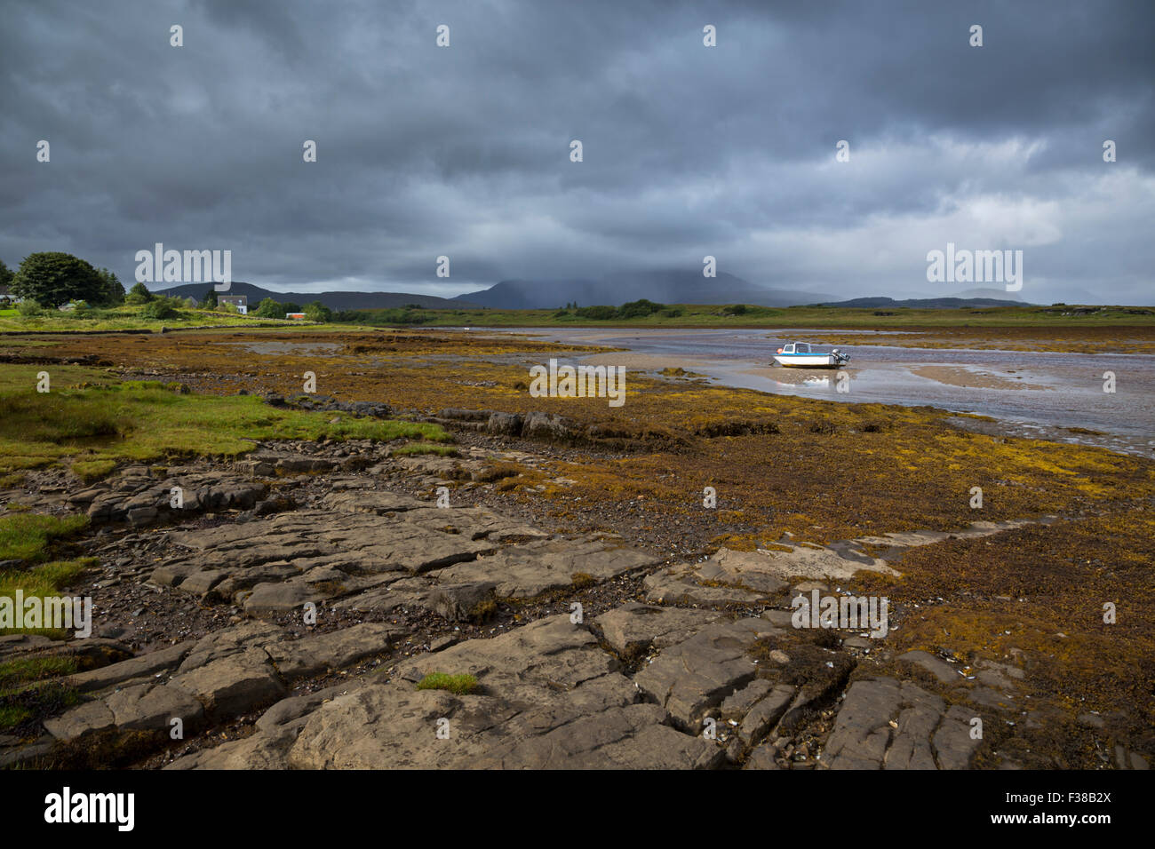 Small boat in a narrow tidal inlet on the Isle of Skye Stock Photo - Alamy