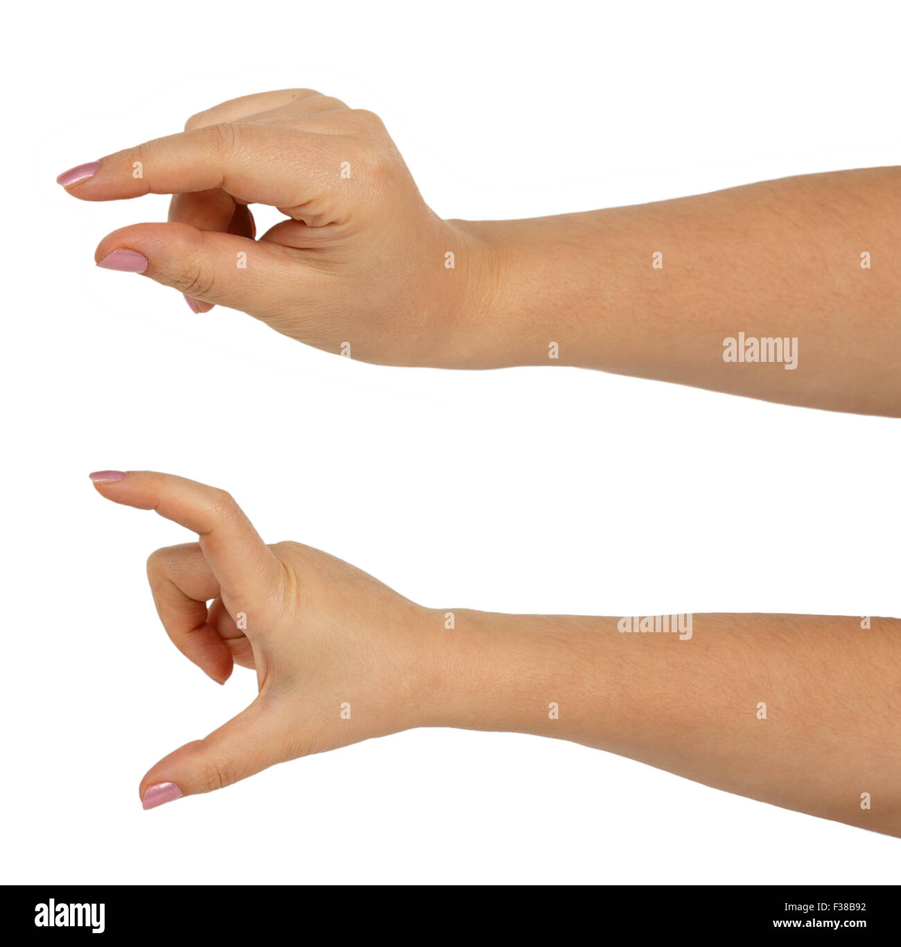 Hands of a caucasian female to hold some small and big objects isolated ...