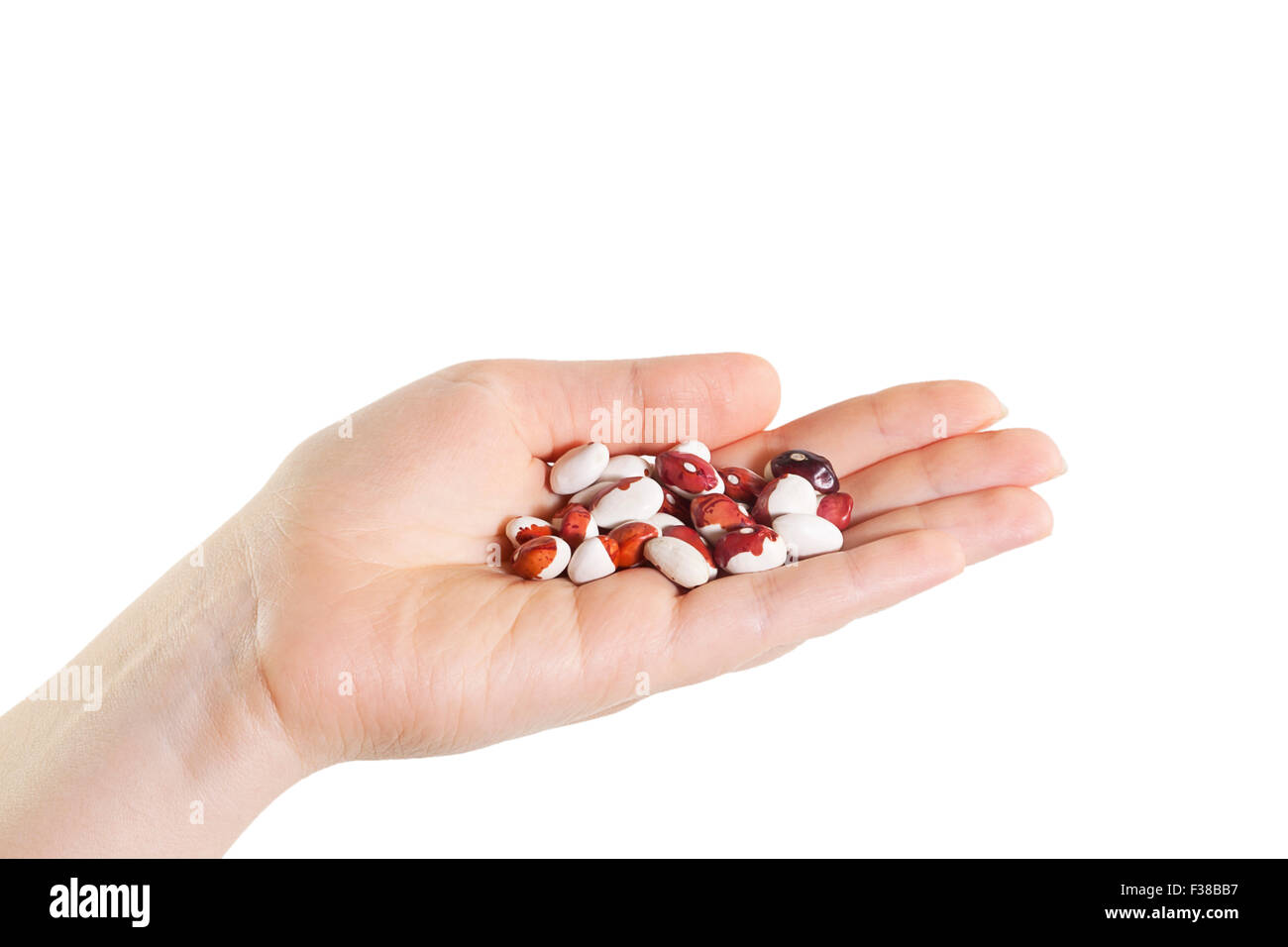 handful of beans in a female hand isolated on white background Stock ...