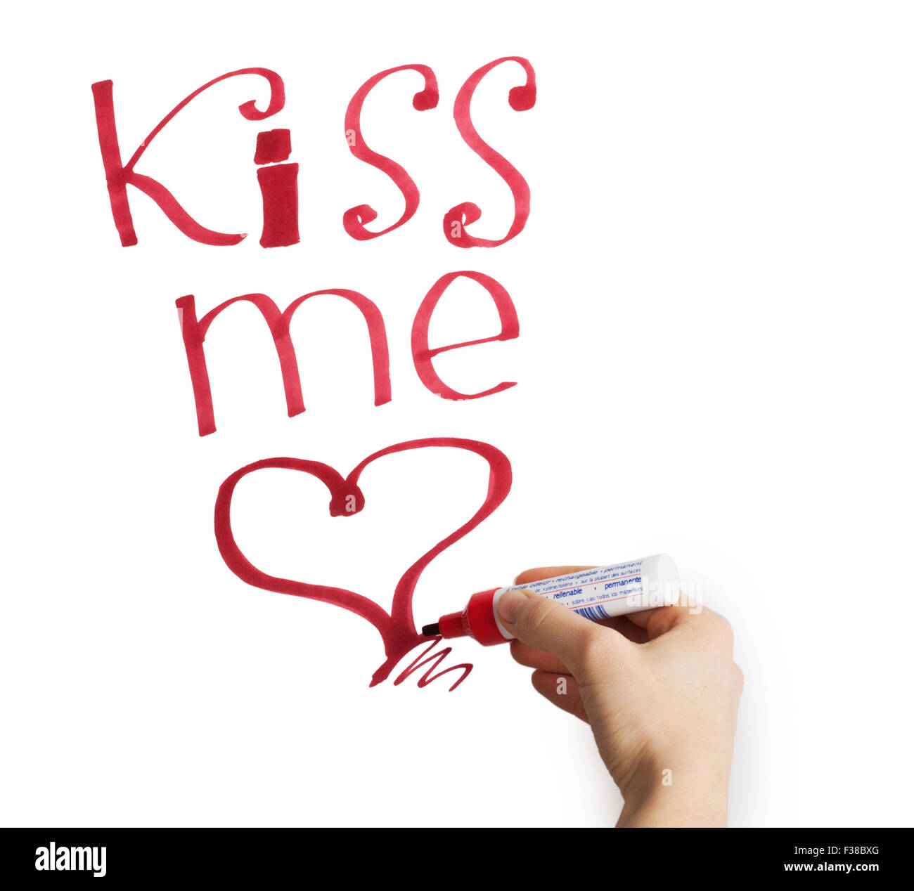 Female hand writing "kiss me" marker on a white background Stock Photo ...
