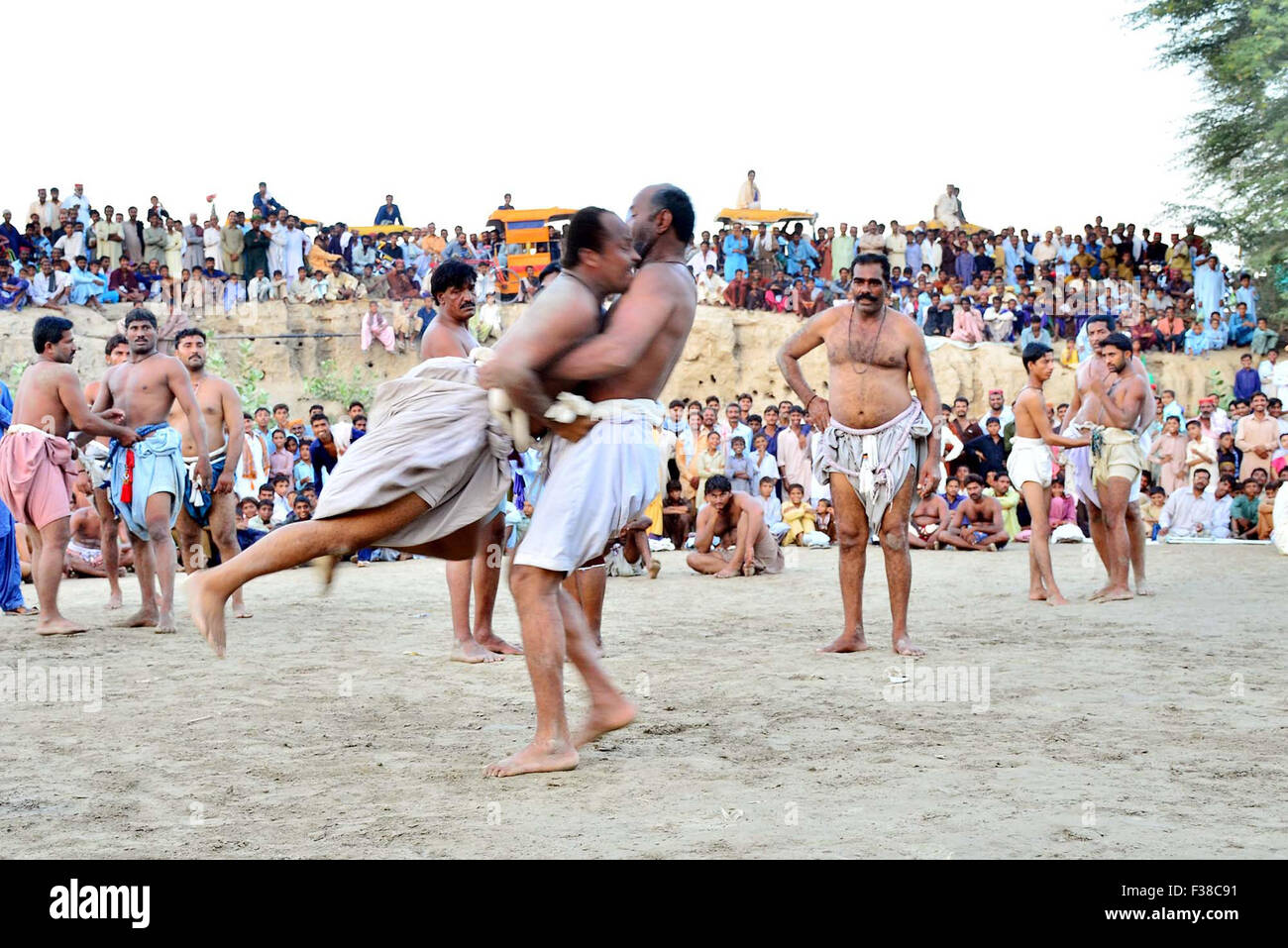 Wrestlers in action during Sindh traditional wrestling Malh on the ...