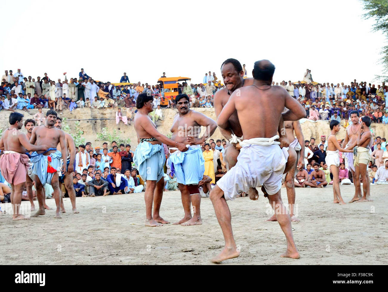 Wrestlers in action during Sindh traditional wrestling Malh on the ...