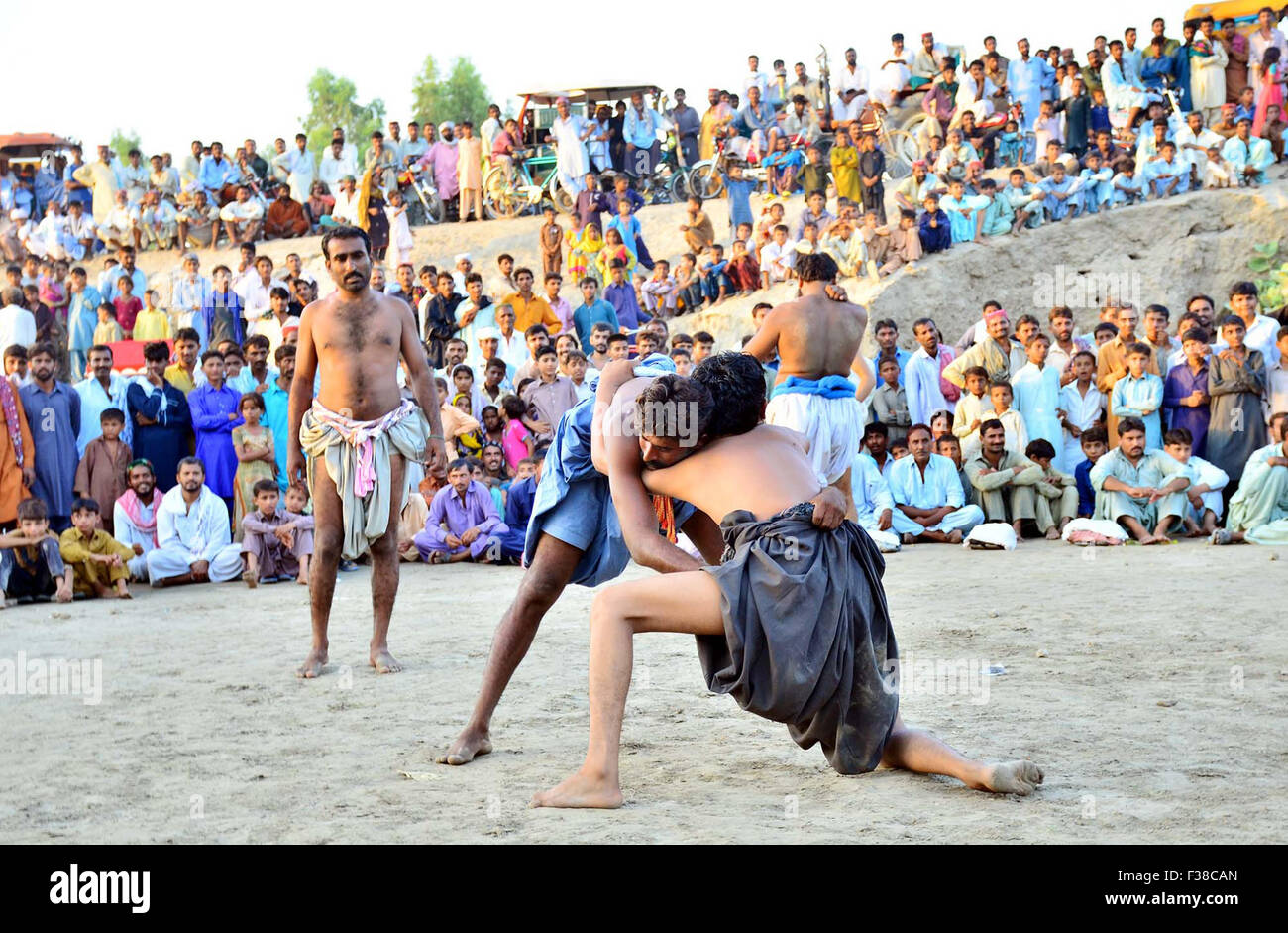 Wrestlers in action during Sindh traditional wrestling Malh on the ...