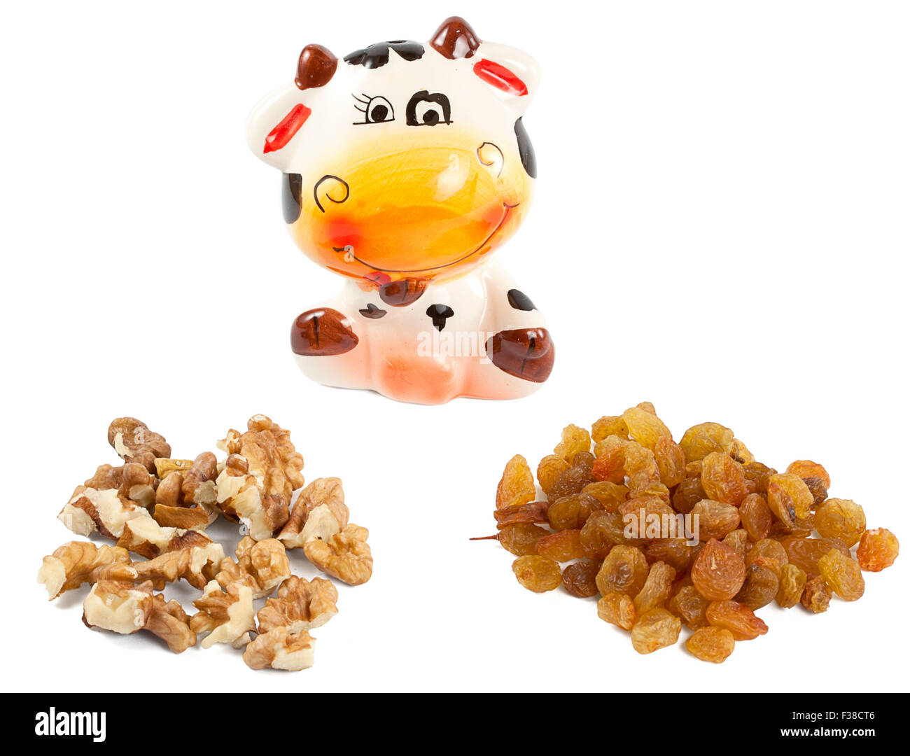 porcelain cow with nuts and raisins isolated on white background Stock ...