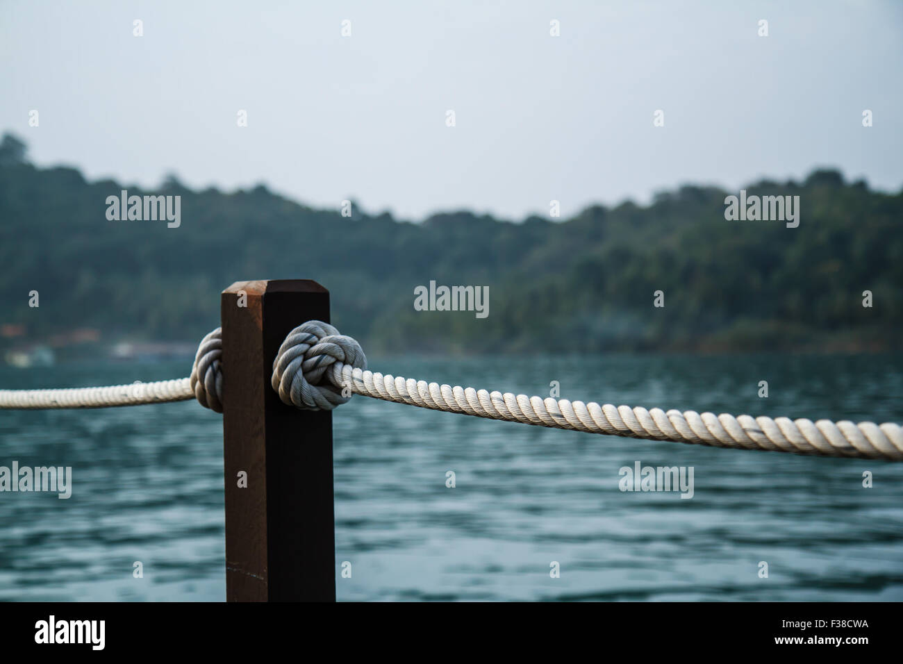 White rope tied into a knot Stock Photo - Alamy