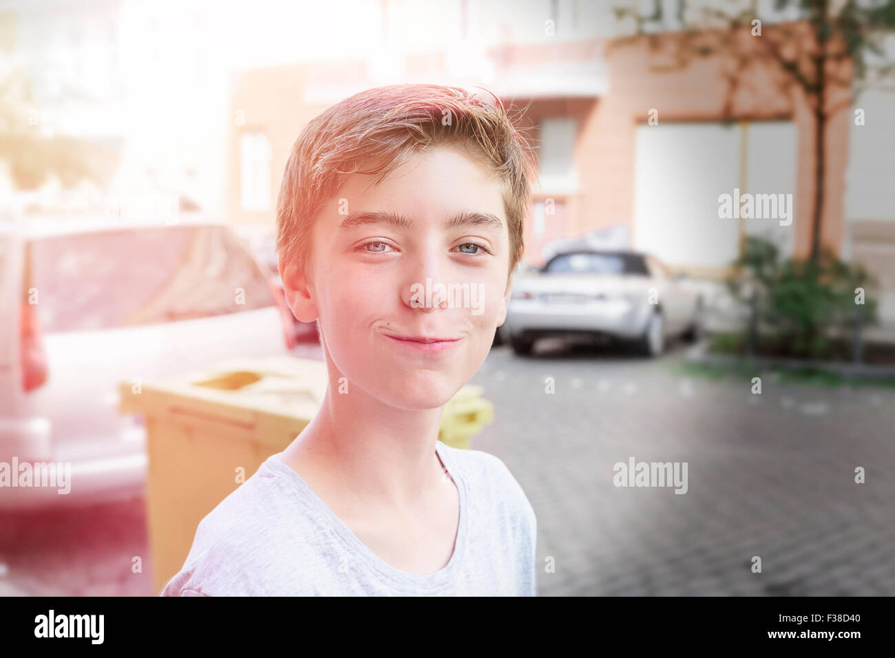 portrait of a smiling teenage boy on a street Stock Photo - Alamy