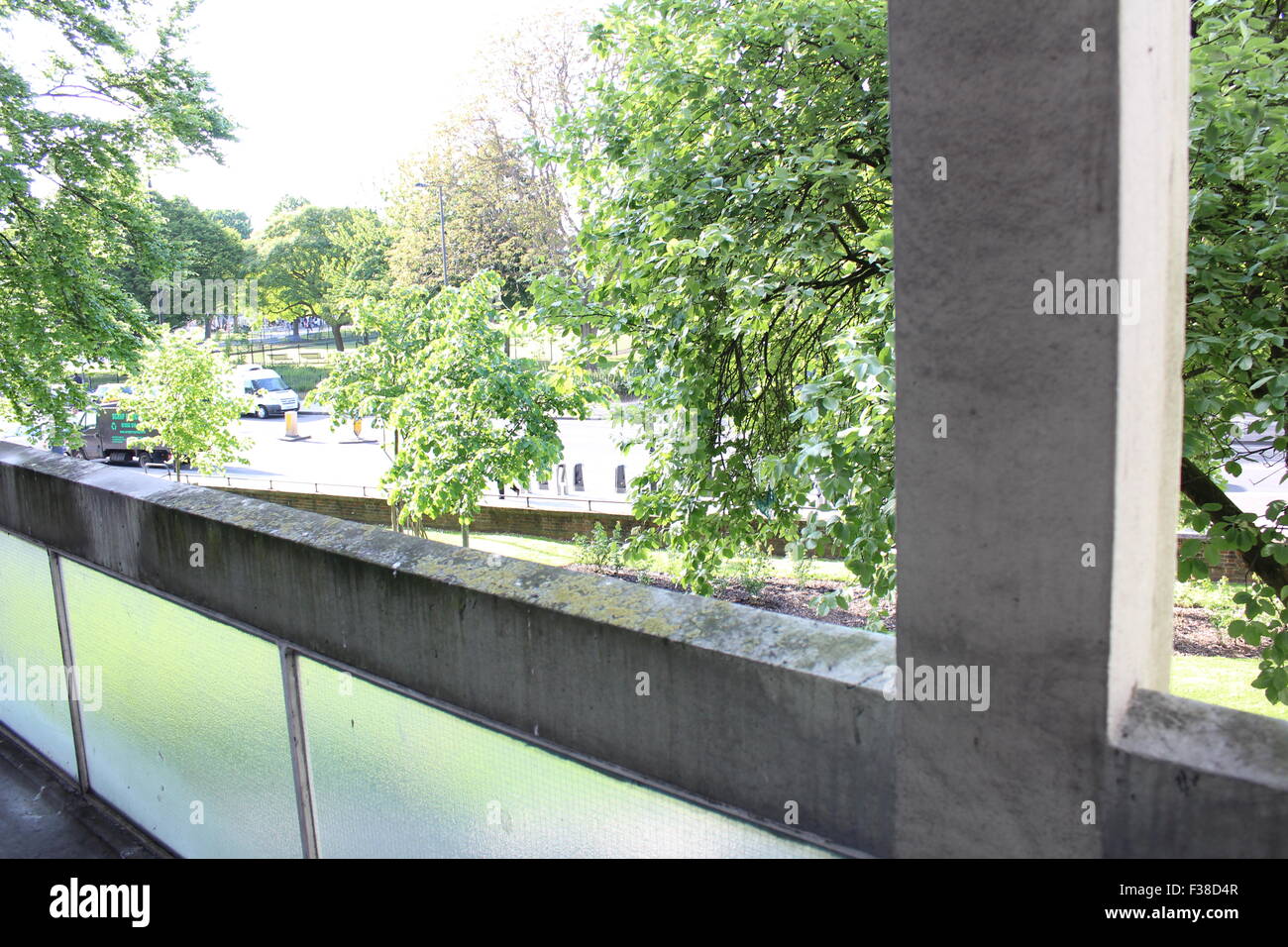 Balcony overlooking tress and park Stock Photo - Alamy