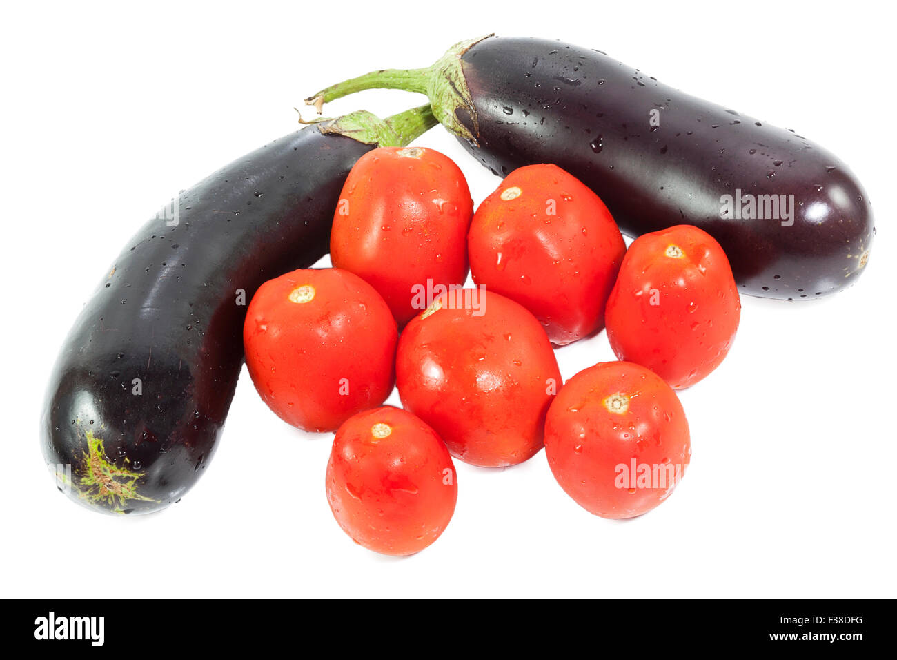 two eggplant and seven tomato isolated on white background Stock Photo ...