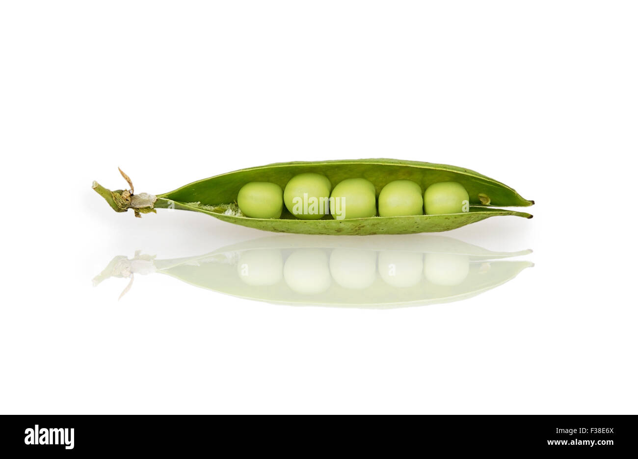 Open pod with peas isolated on white background Stock Photo - Alamy