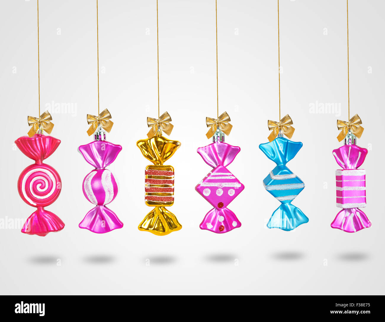Bright Christmas tree toy candies with bow isolated on white background ...