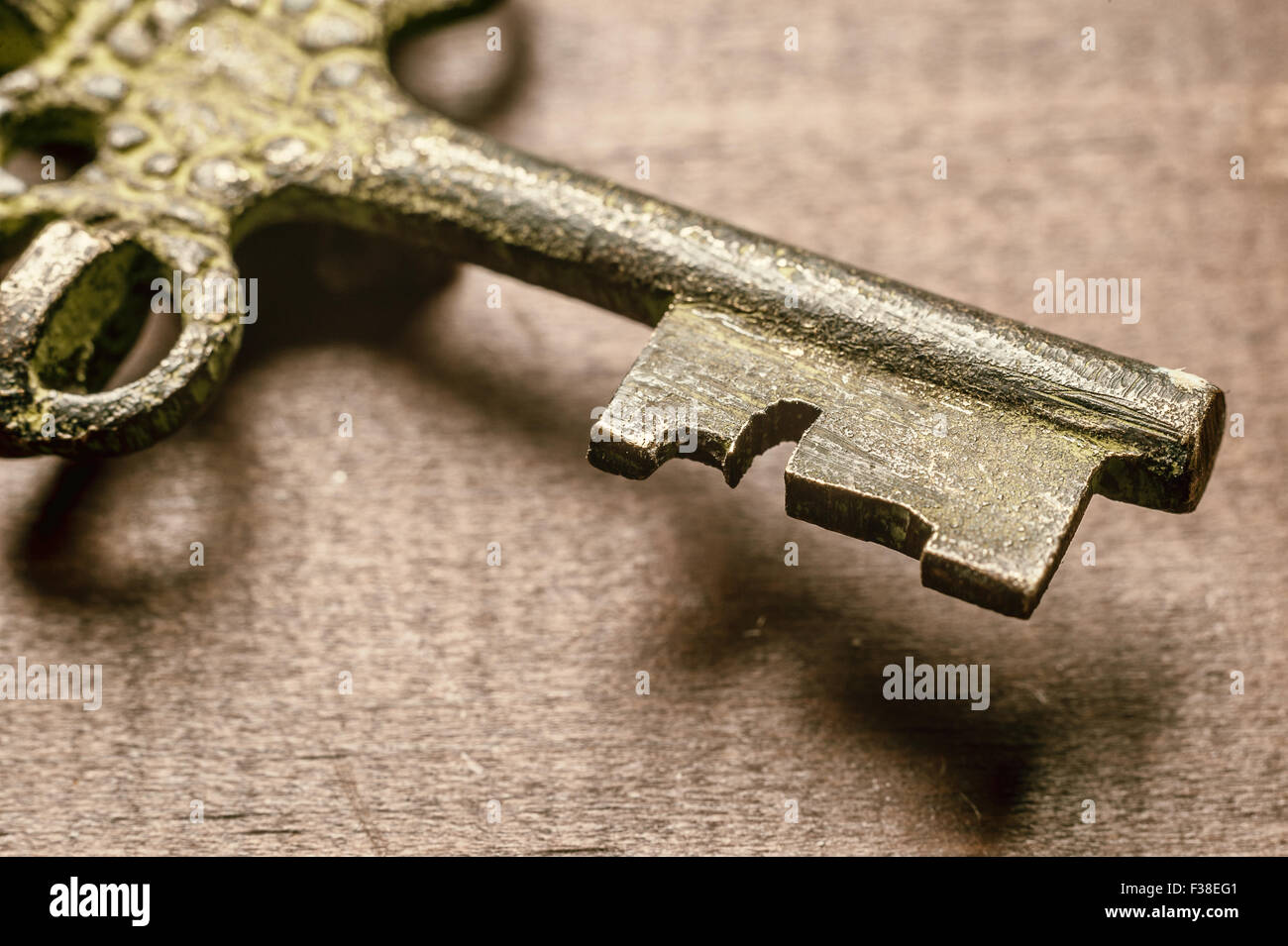 Old treasure key on wood surface Stock Photo - Alamy
