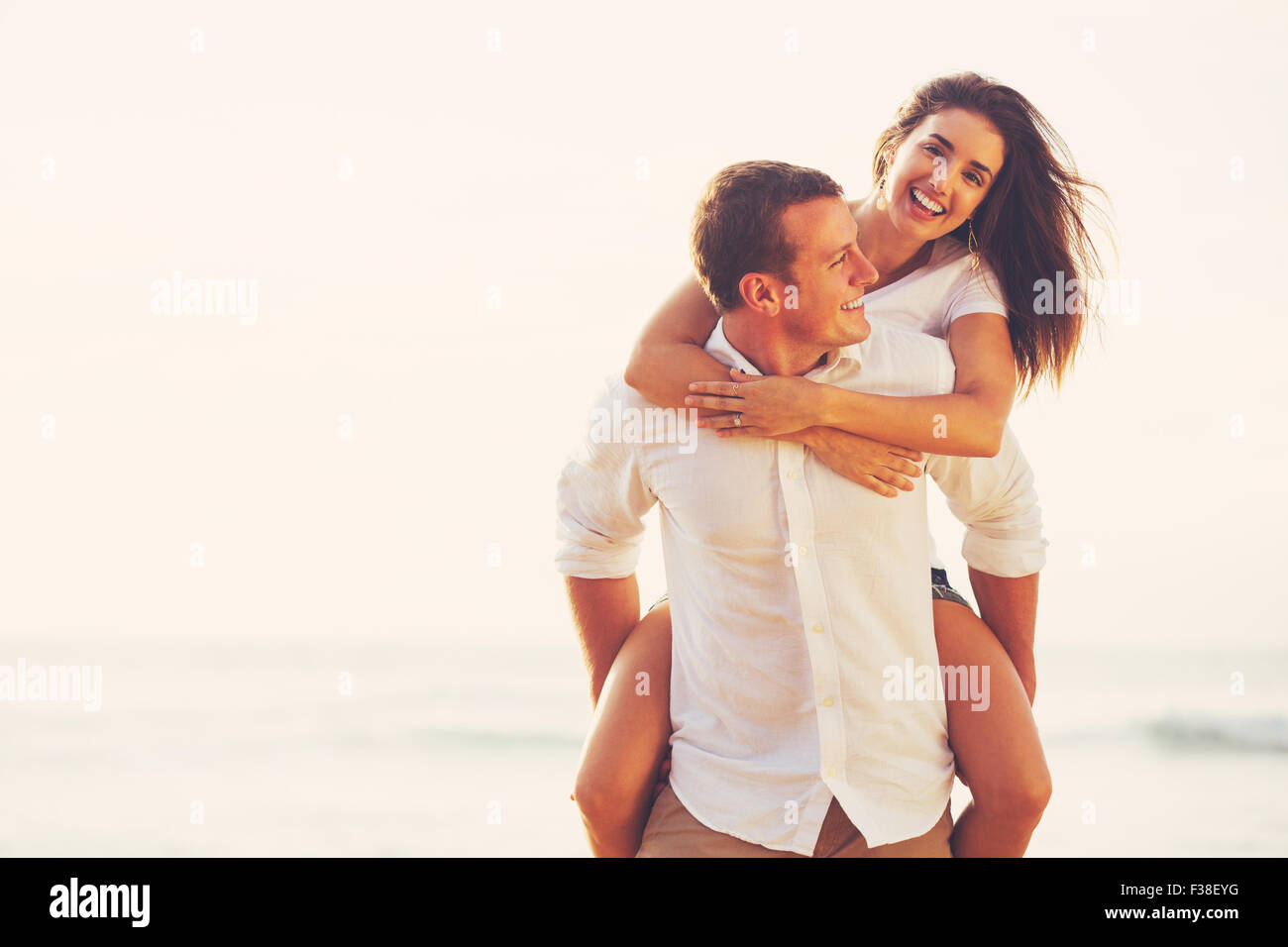 Couple fun on beach hi-res stock photography and images - Alamy