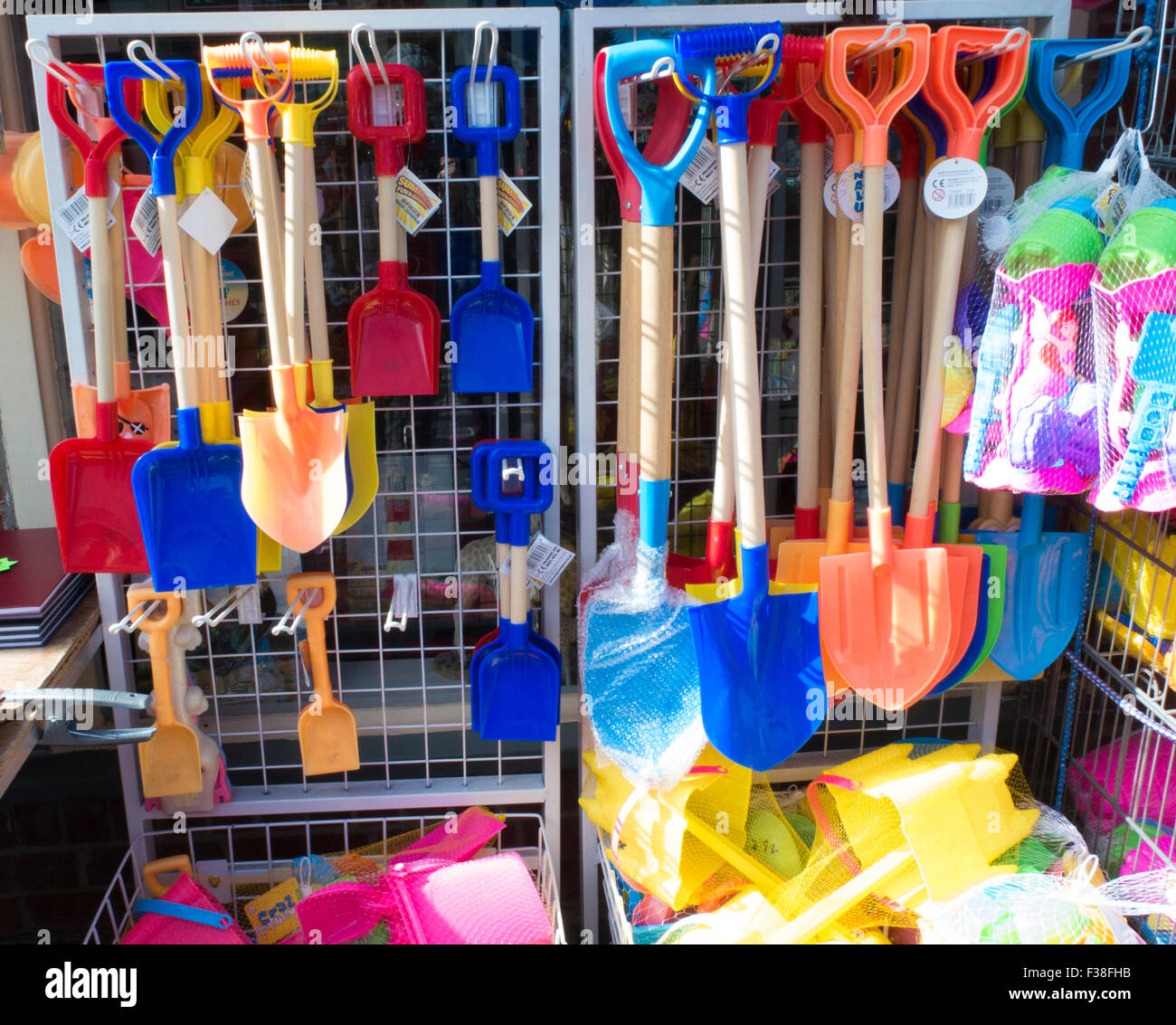 Colourful beach spades and buckets Stock Photo - Alamy