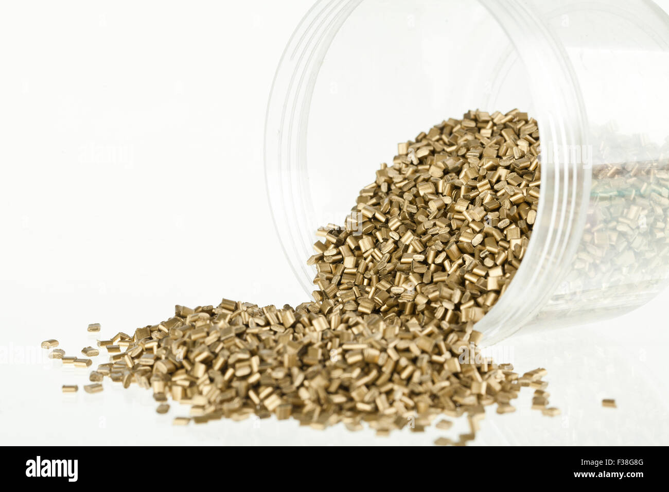 gold plastic granules close up Stock Photo - Alamy