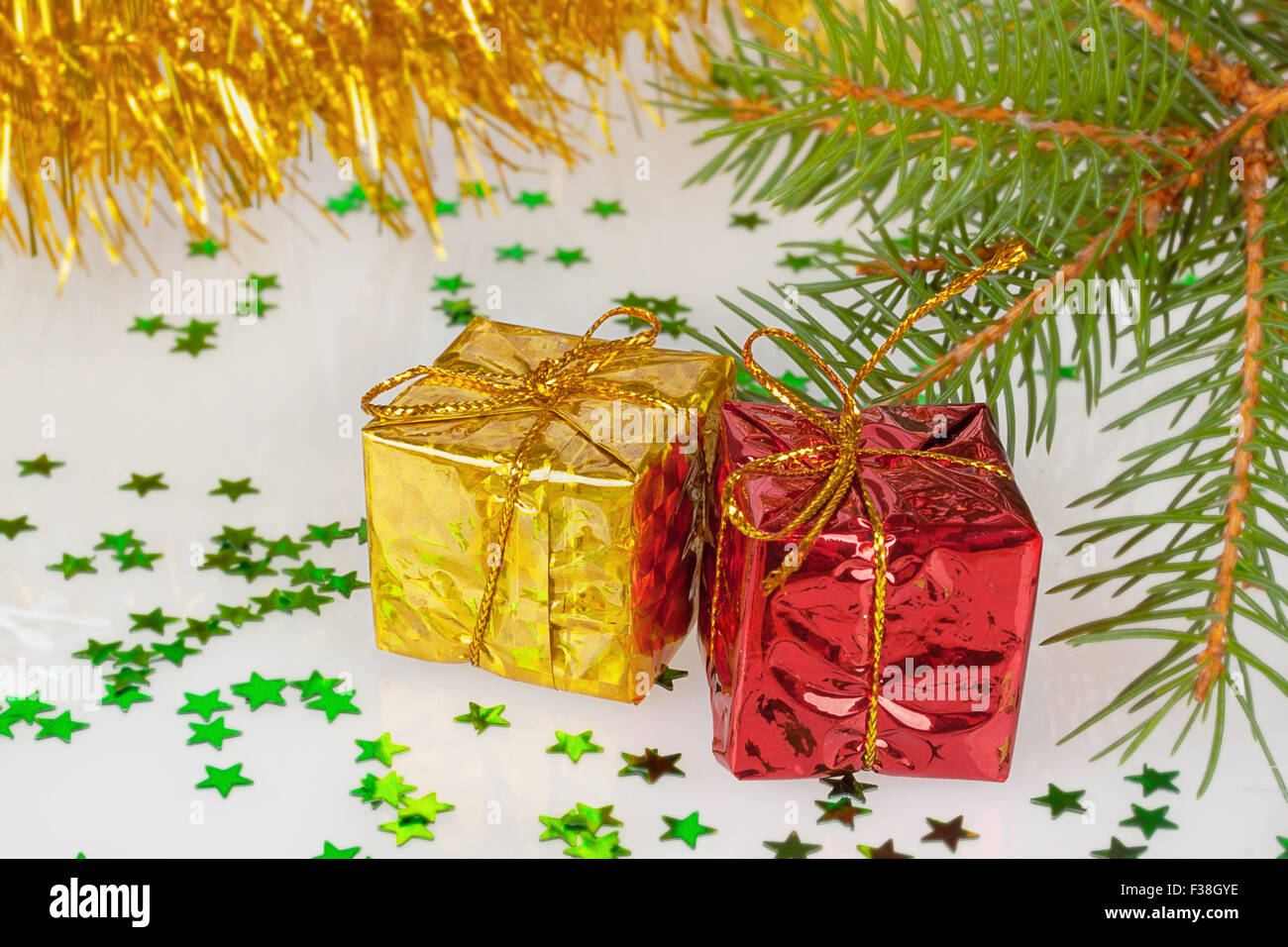 two Christmas gifts under the tree Stock Photo - Alamy