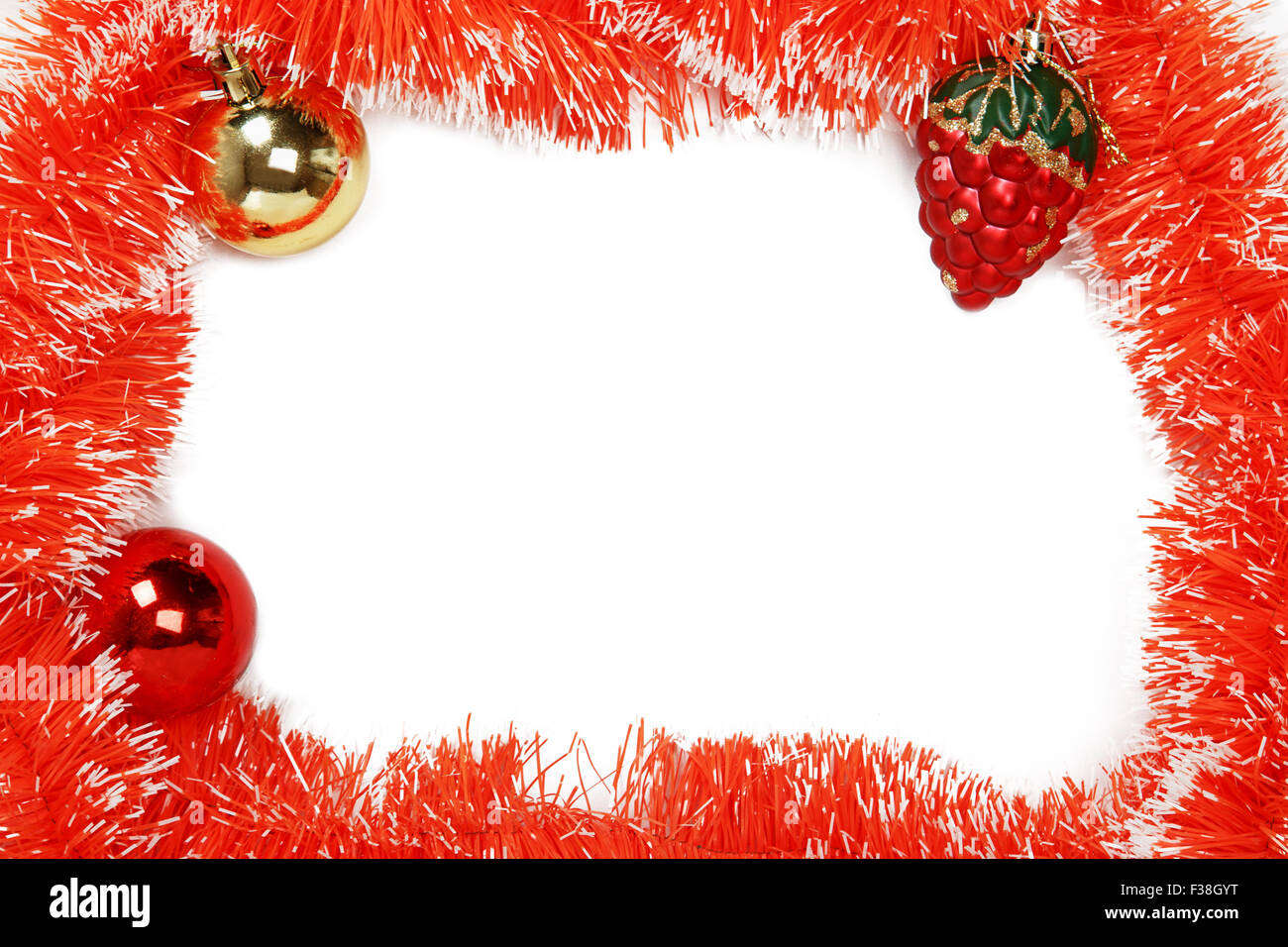 Frame of orange Christmas garland with Christmas toys on a white ...