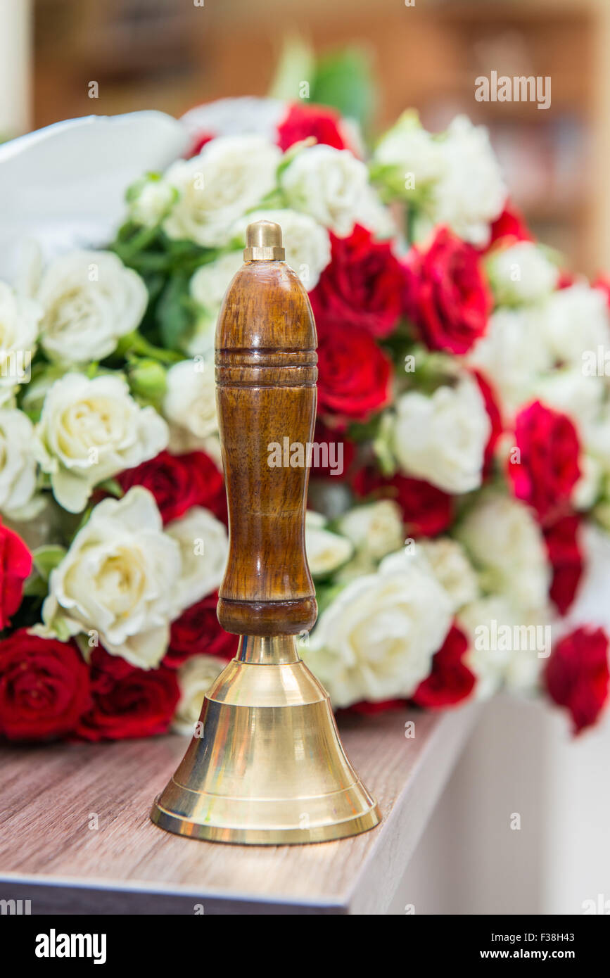 Old school bell with yellow flowers. Last call, graduation Stock Photo ...