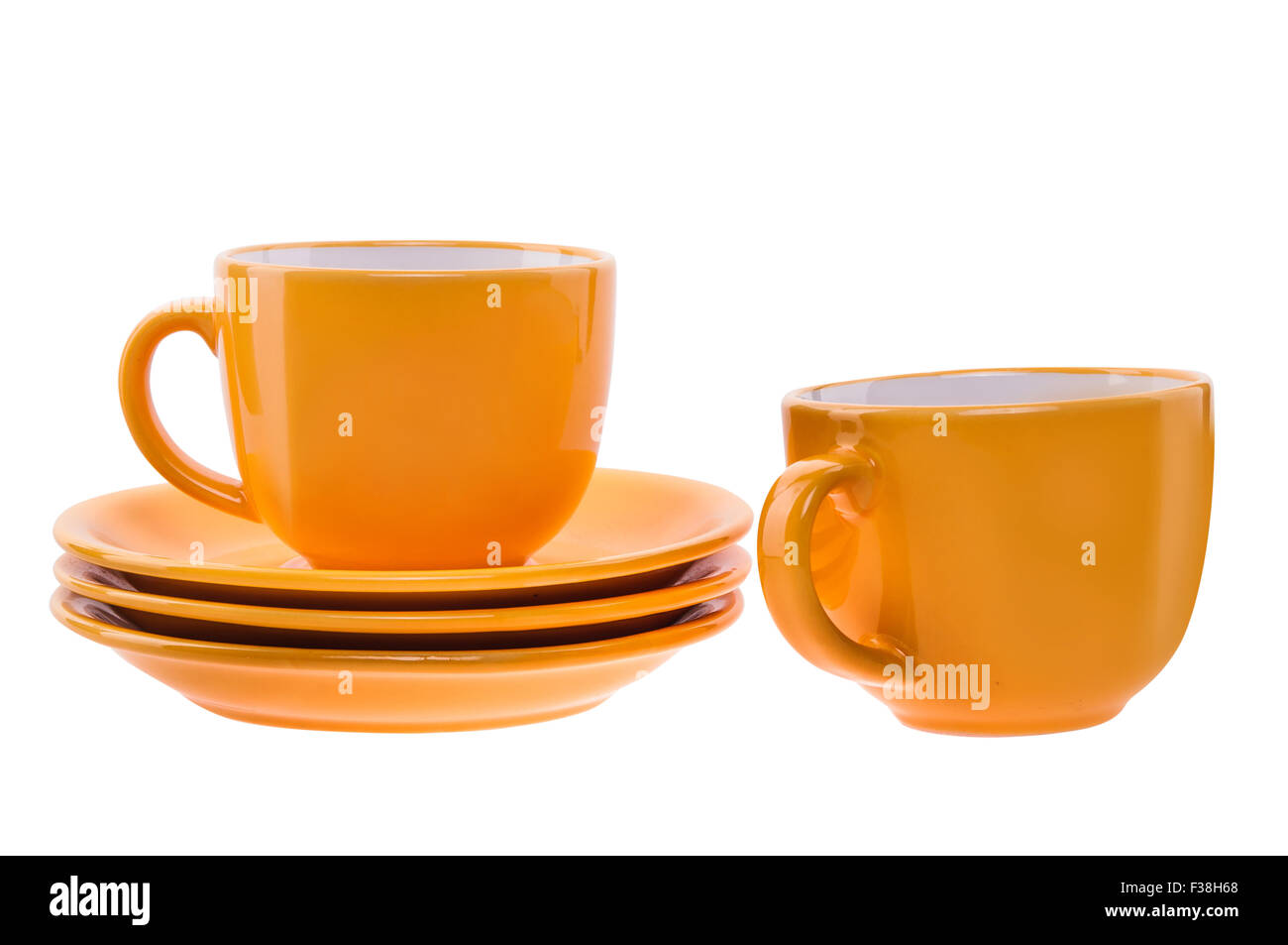 orange cup and saucer isolated on a white background Stock Photo - Alamy