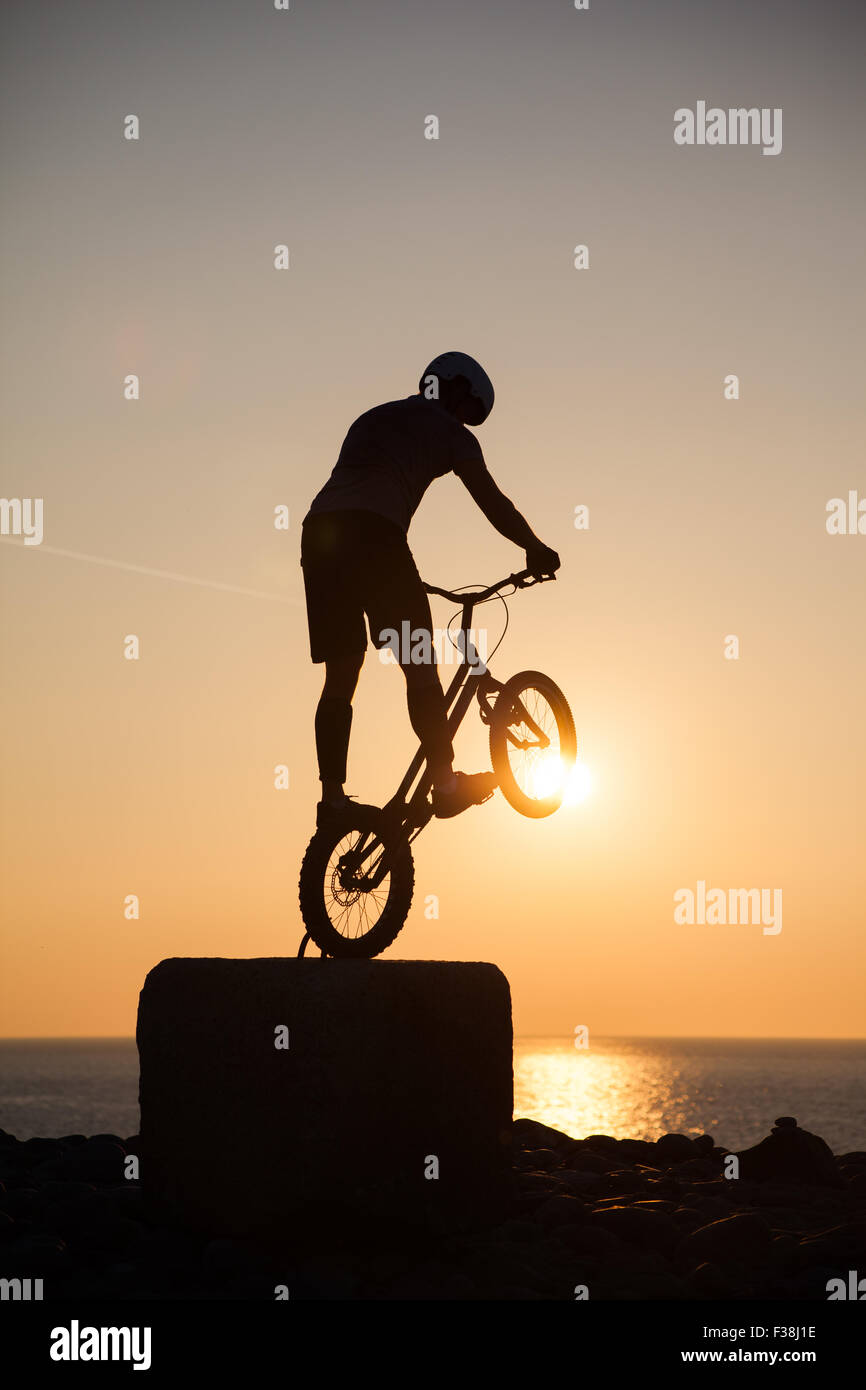 Young people performing tricks riding hi-res stock photography and ...