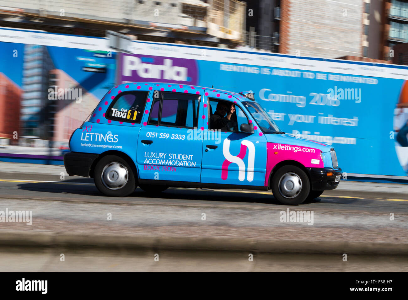 A blurred moving LT1 hackney cab taxi at speed motion blur on 'The ...