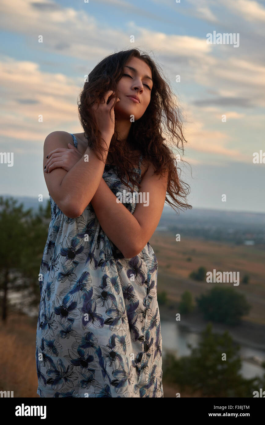 evening girl portrait on plain background Stock Photo - Alamy