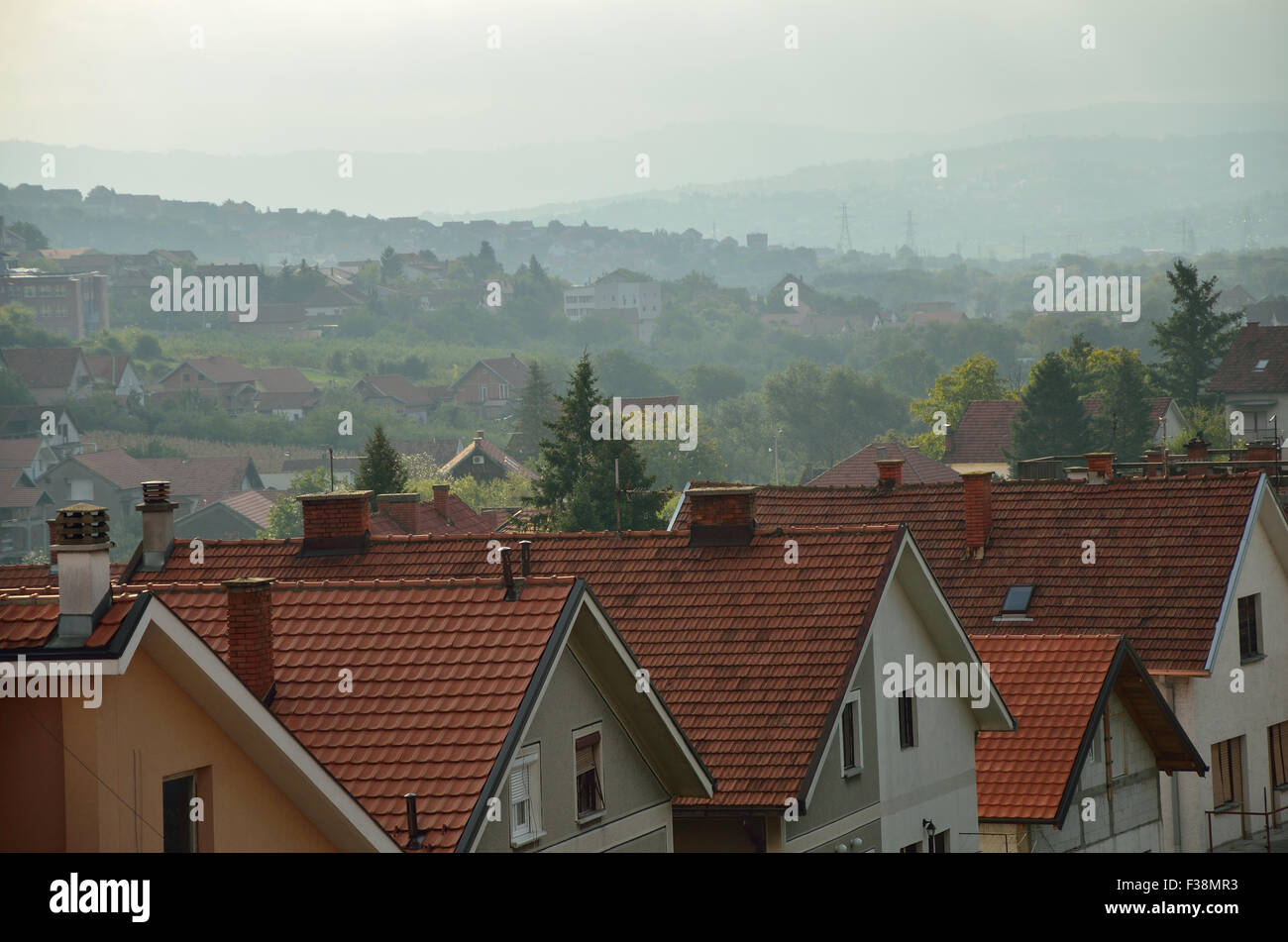 Line of houses with suburban panorama in morning mist Stock Photo - Alamy