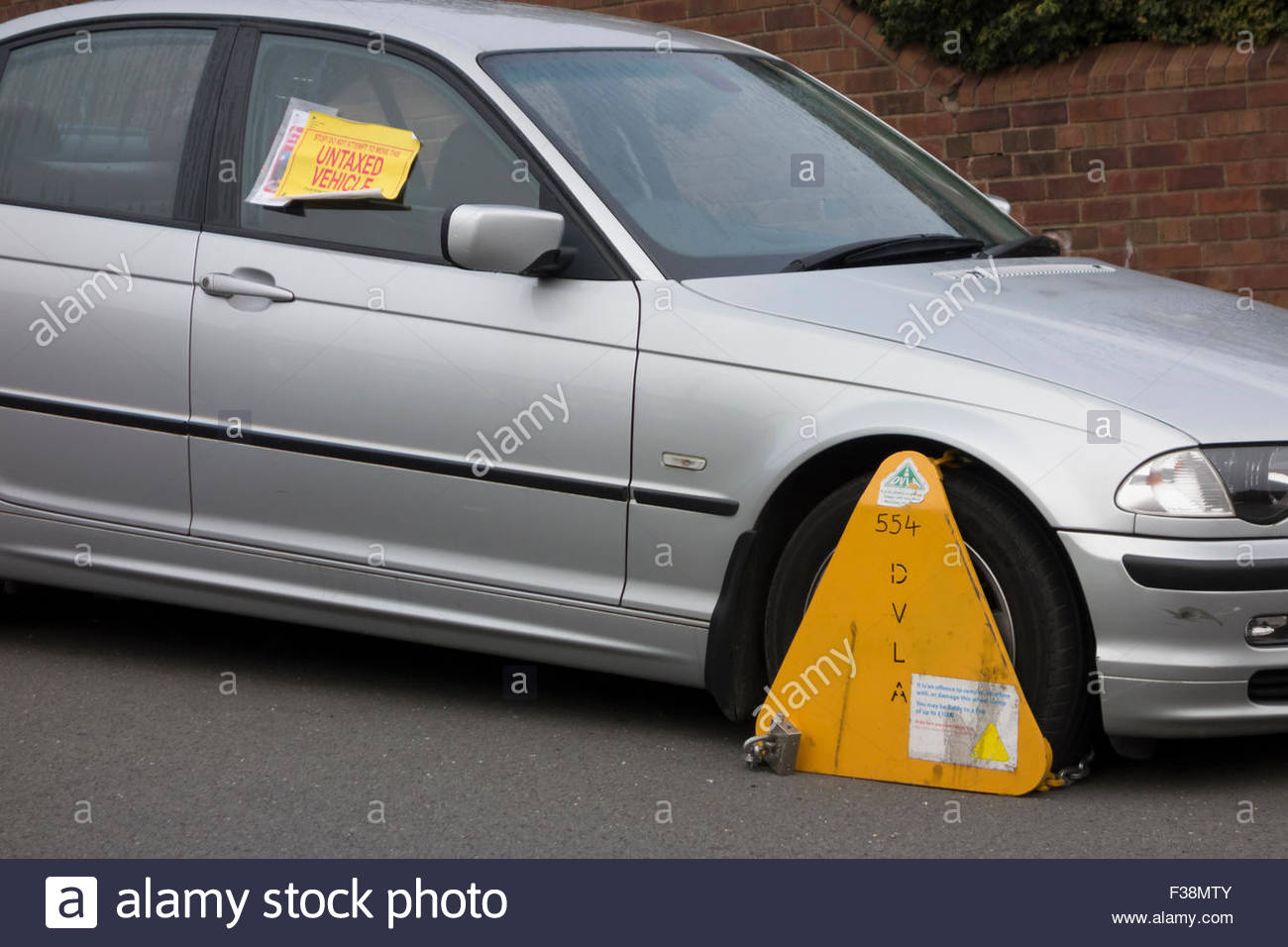 Untaxed Vehicle Dvla Wheel Clamp High Resolution Stock Photography and ...