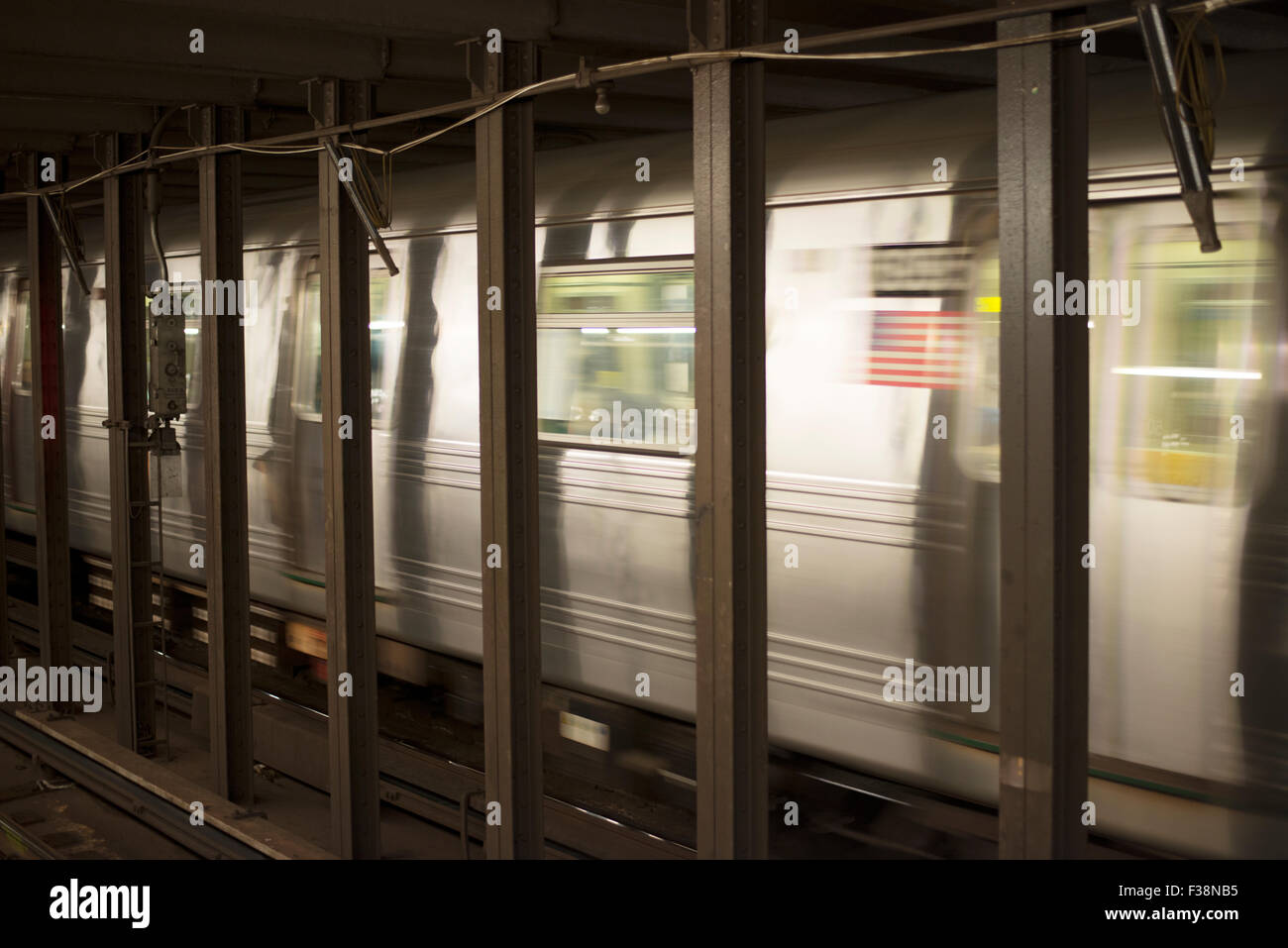 Subway train passes Stock Photo - Alamy
