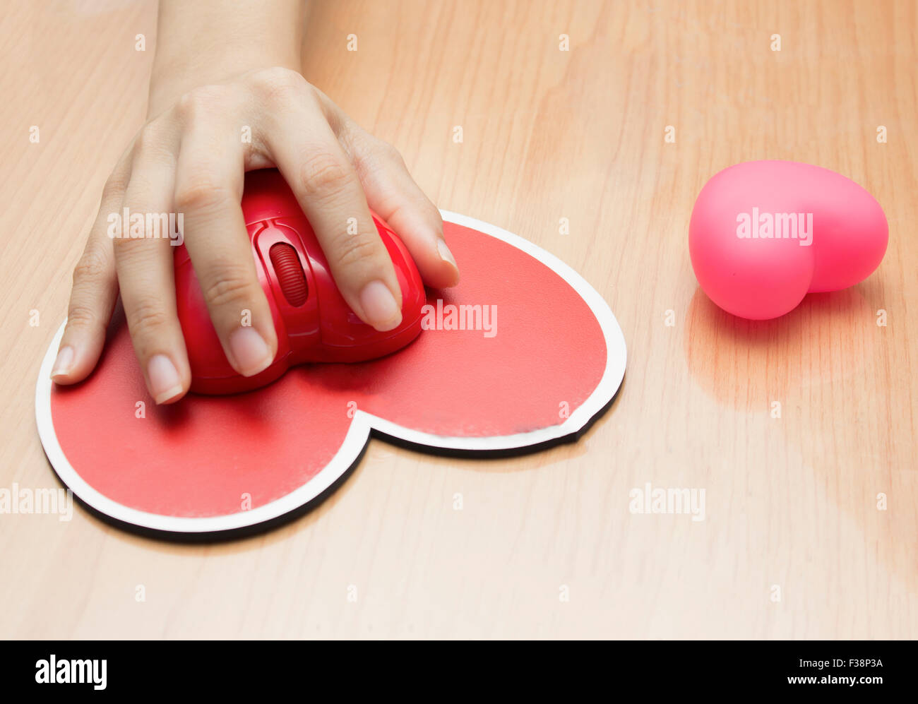 Female hand with computer mouse on table.valentine day Stock Photo - Alamy