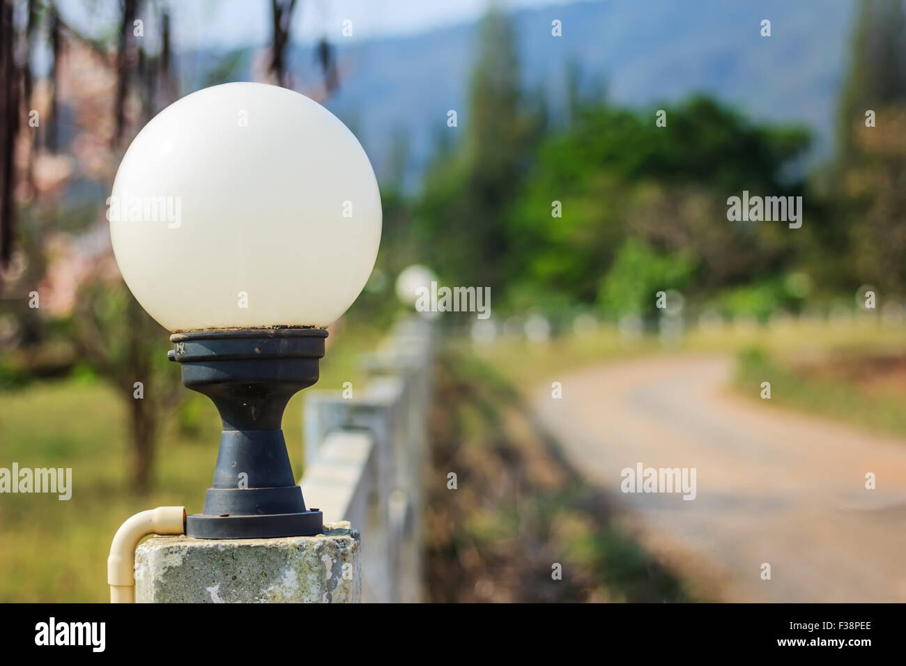 round lamp in road background Stock Photo - Alamy