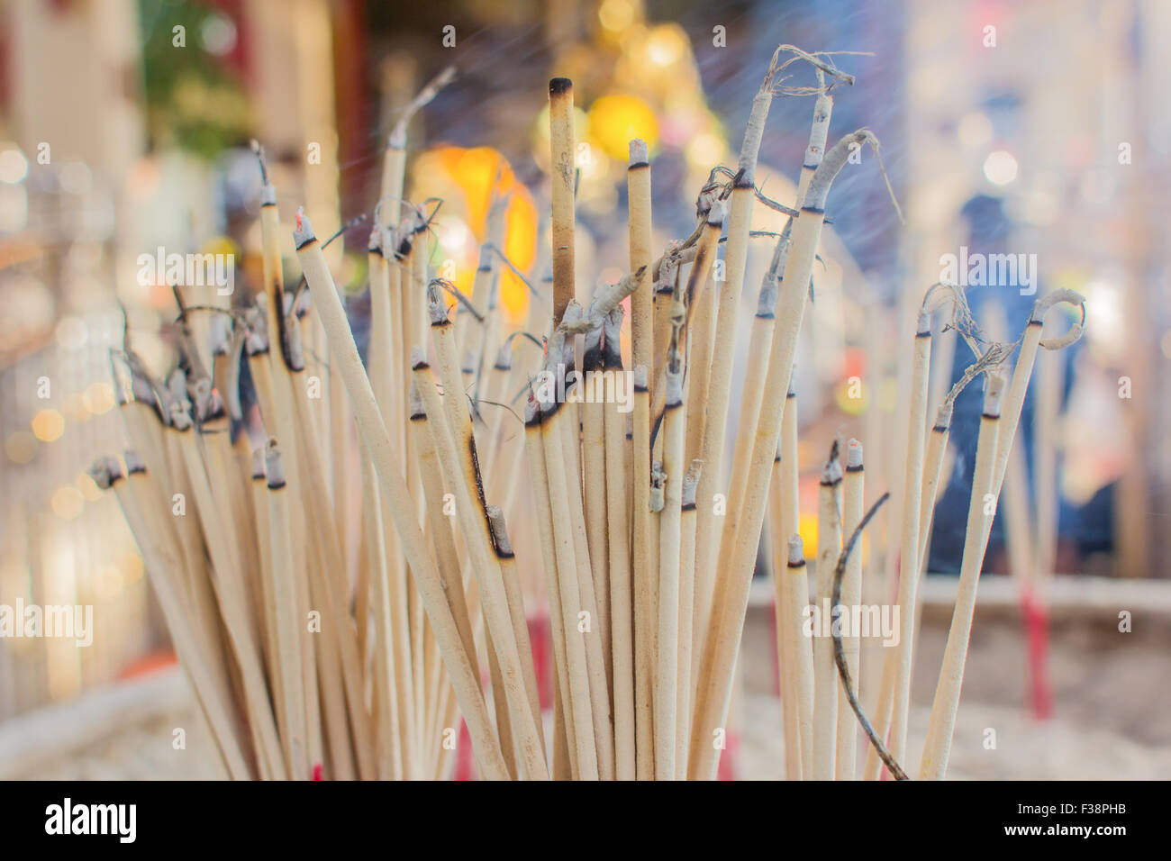 Burning incense in temple Stock Photo - Alamy