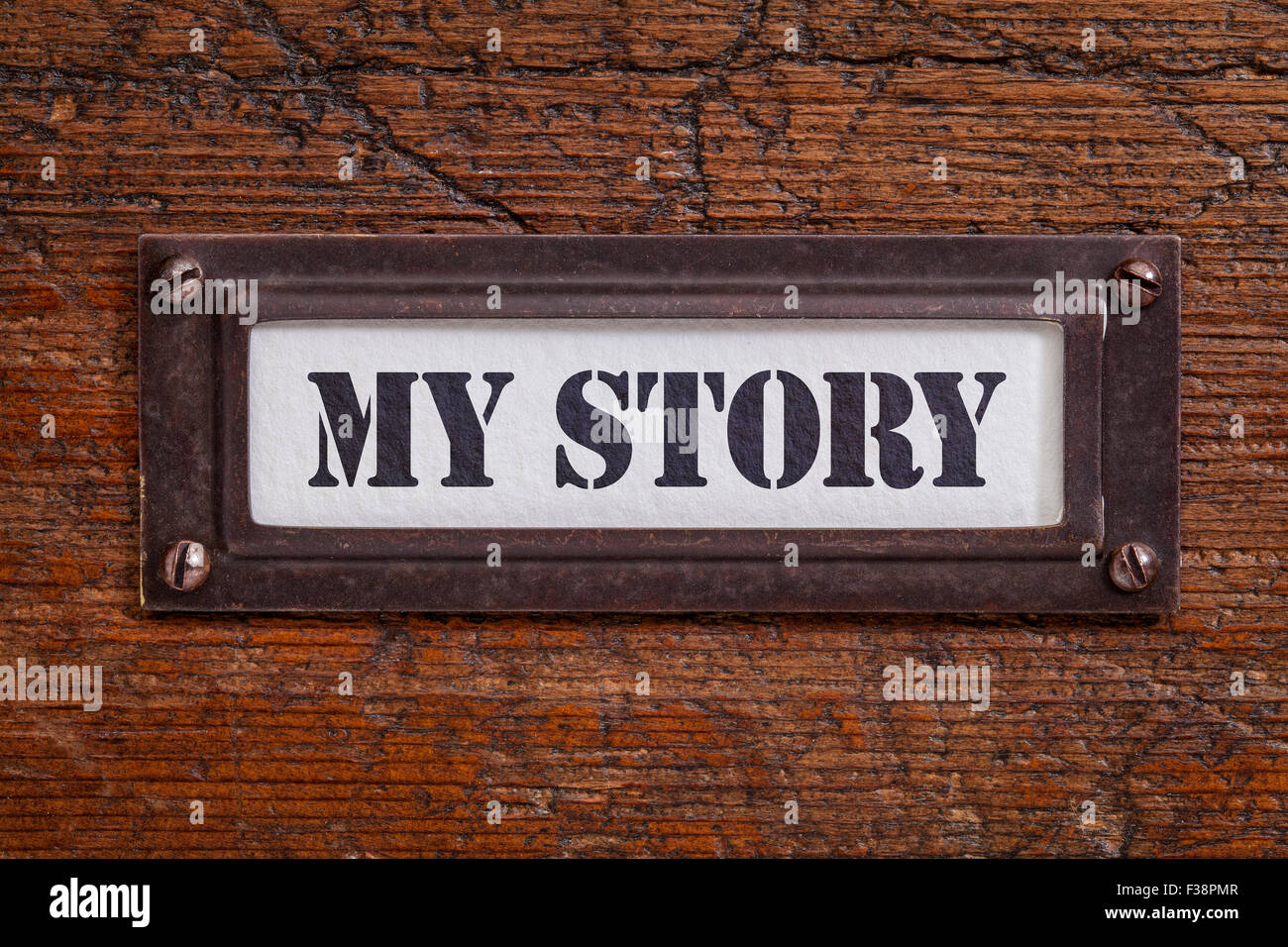 my story - file cabinet label, bronze holder against grunge and ...