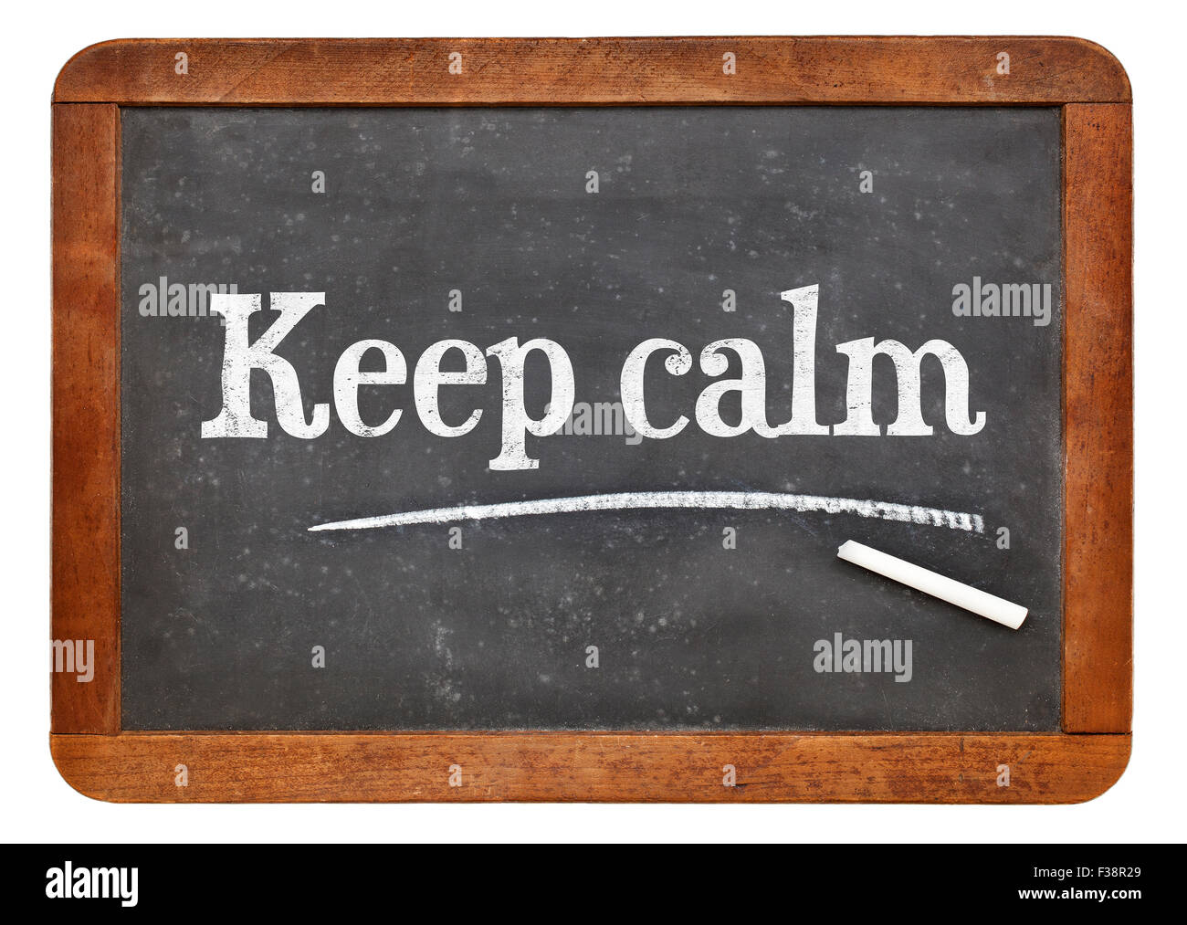Keep calm advice or reminder - white chalk text on a vintage slate ...